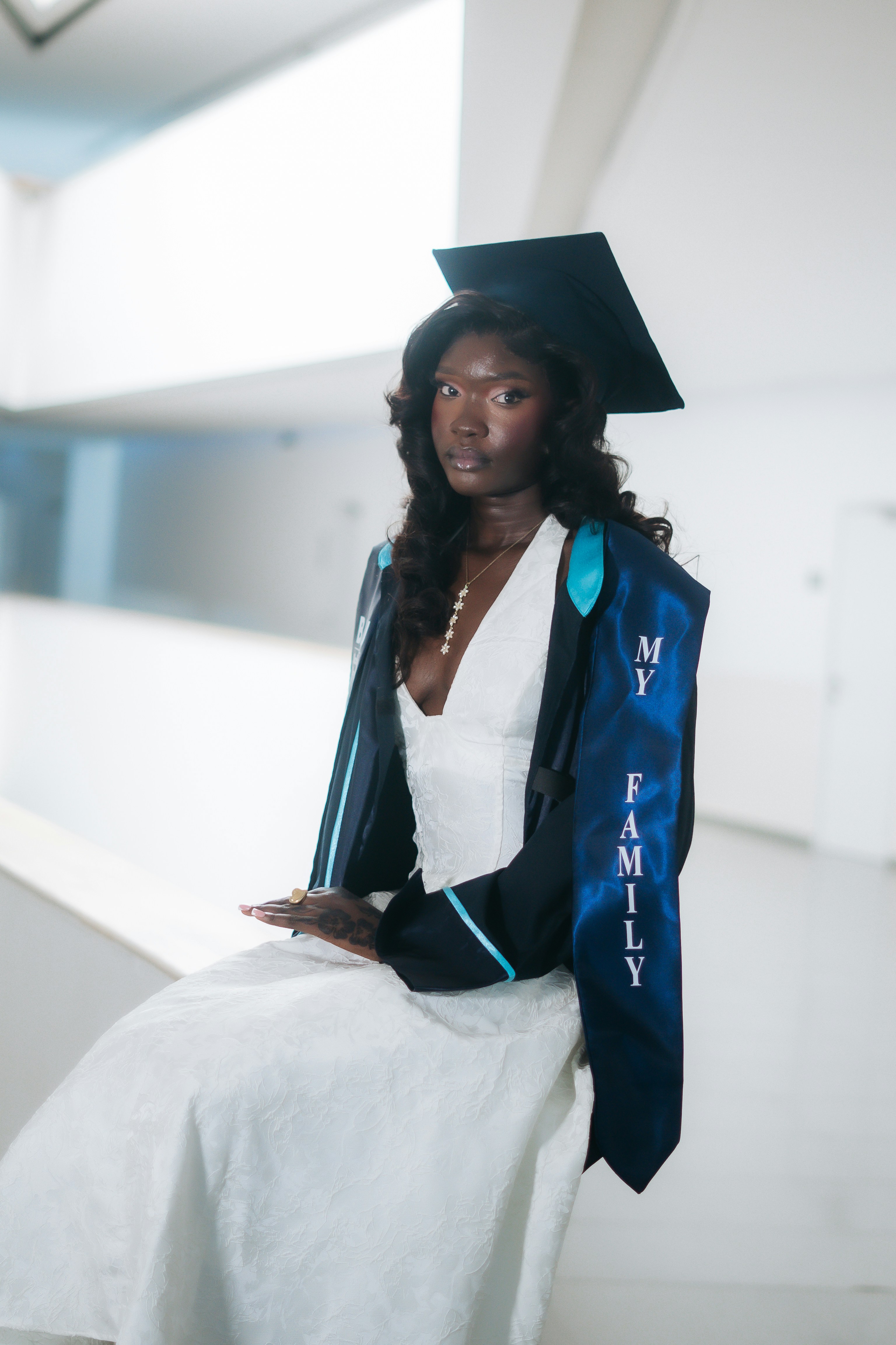 Graduation Moment: Quiet Confidence in a White Gown