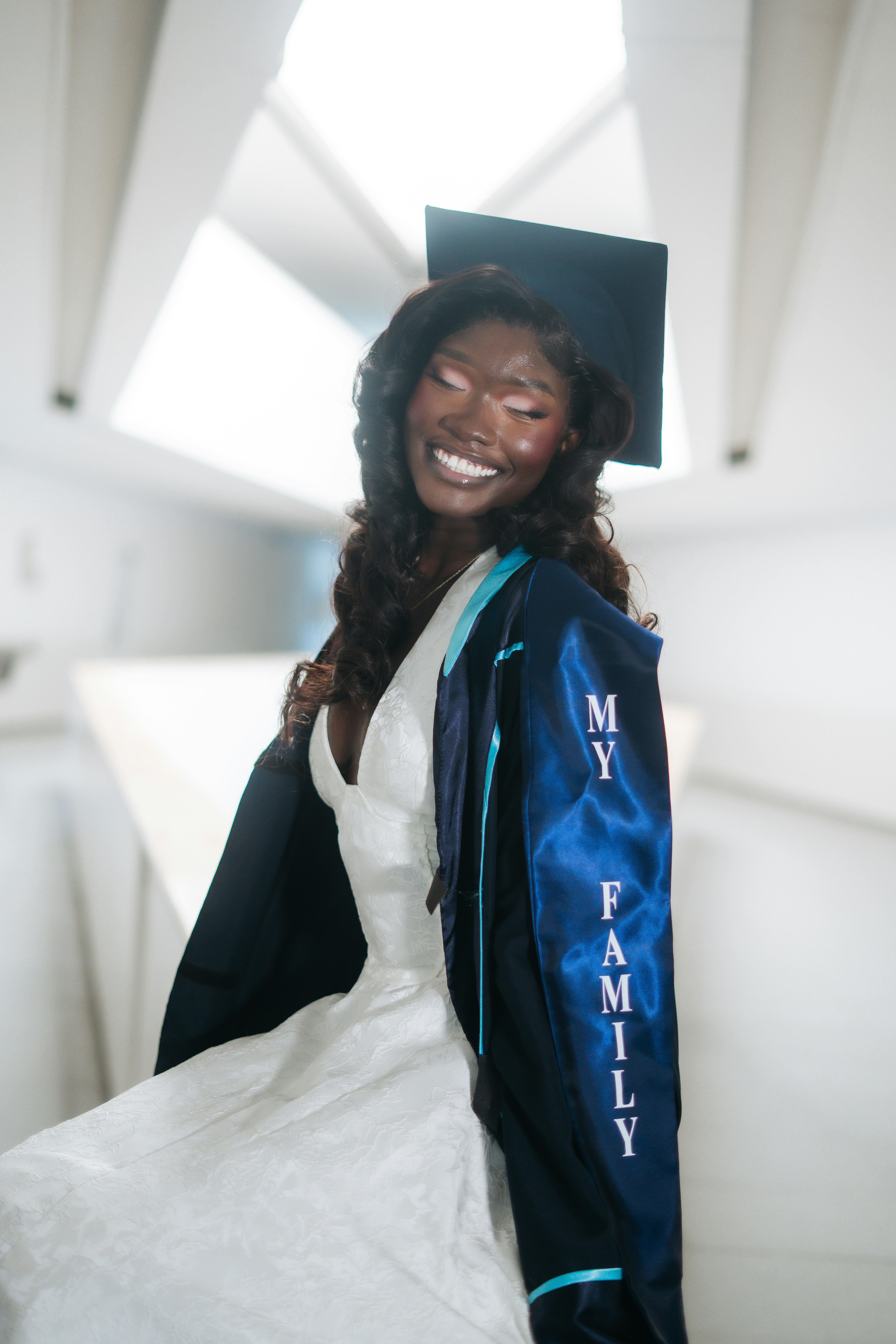 Graduate in Joy: A Smile Under the Gown