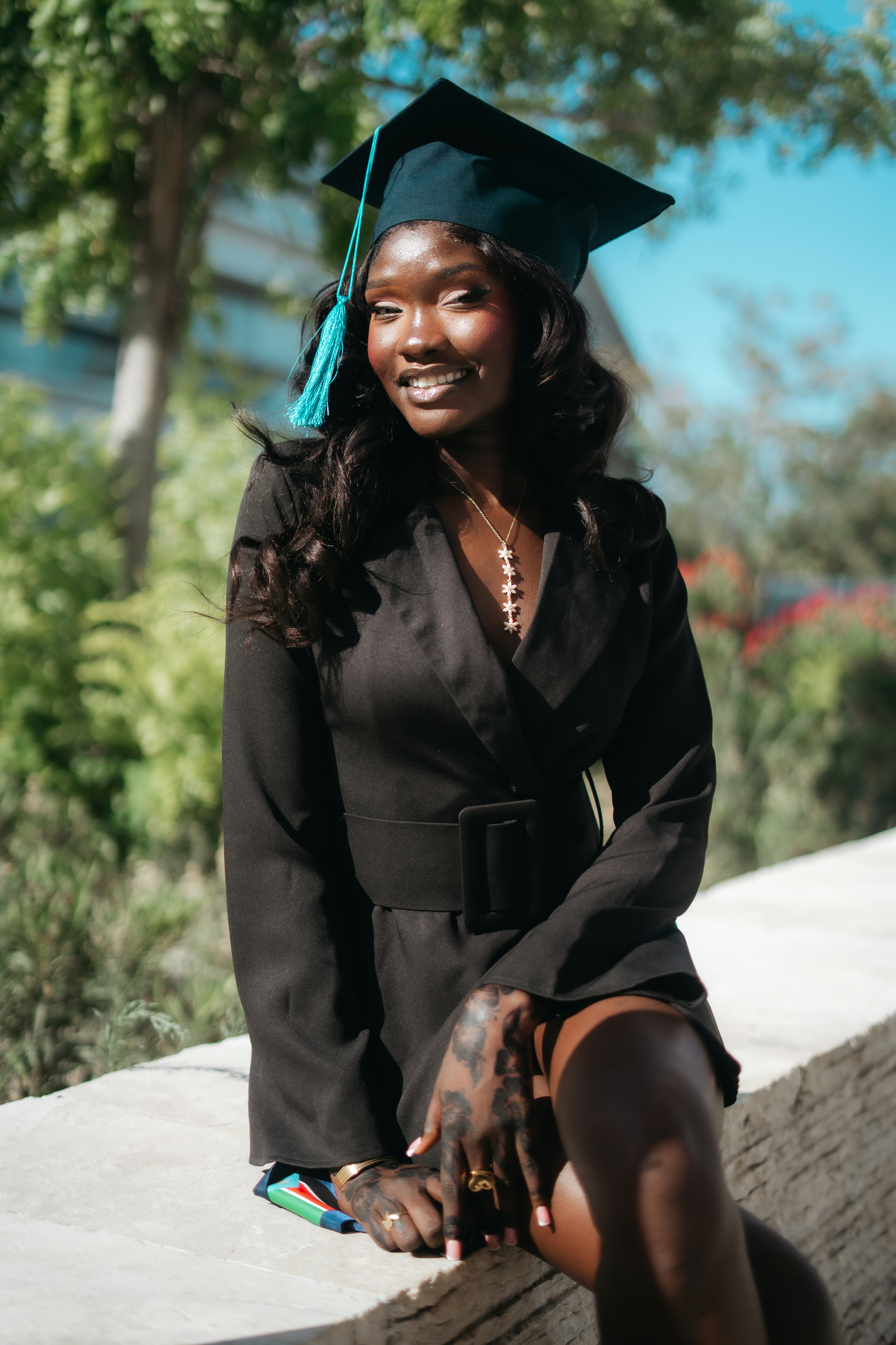 Graduate in Focus: Joyful Confidence under a Turquoise Tassel