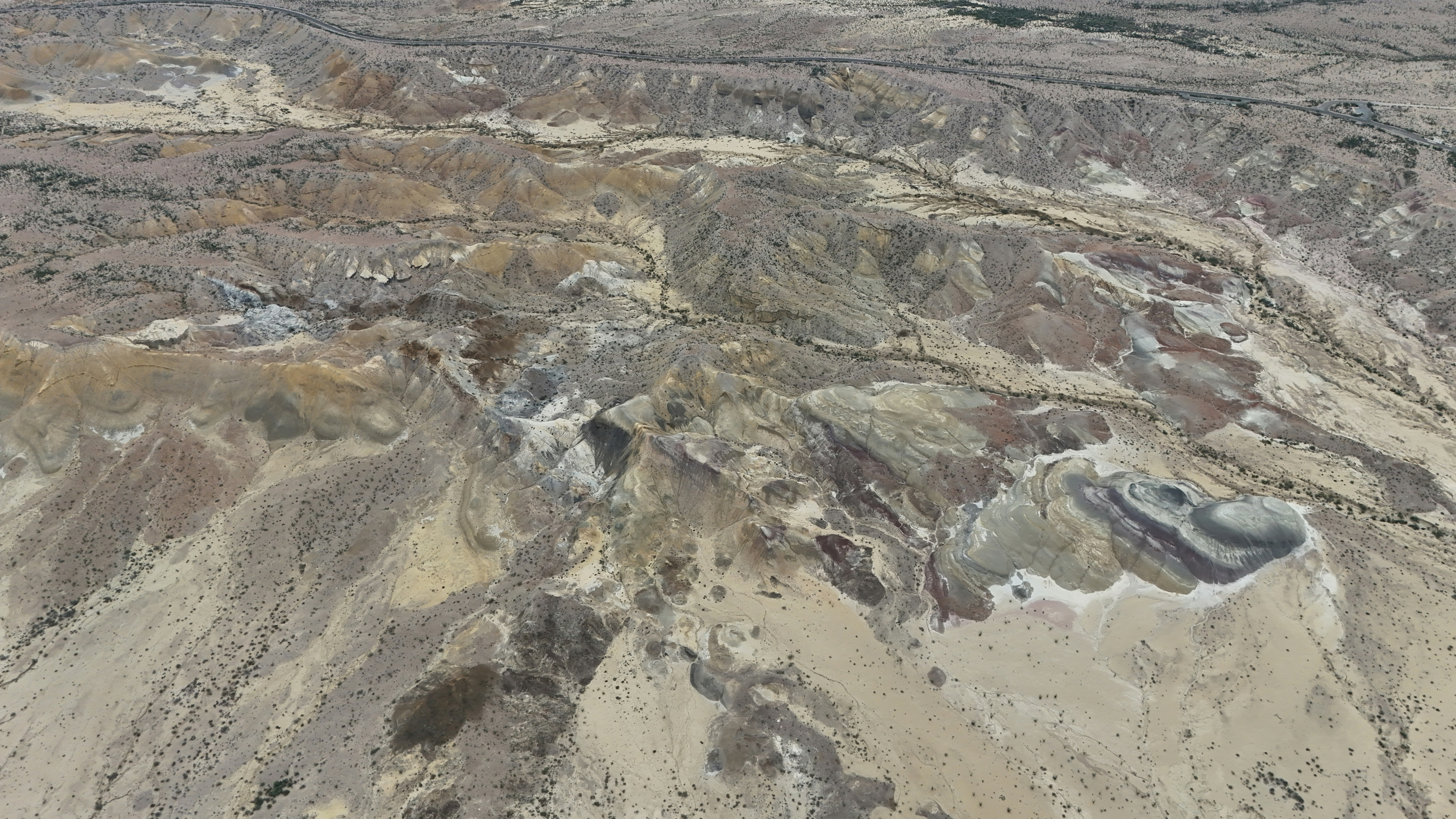 Strata of Echoed Earth: Aerial View of Desert Terraces