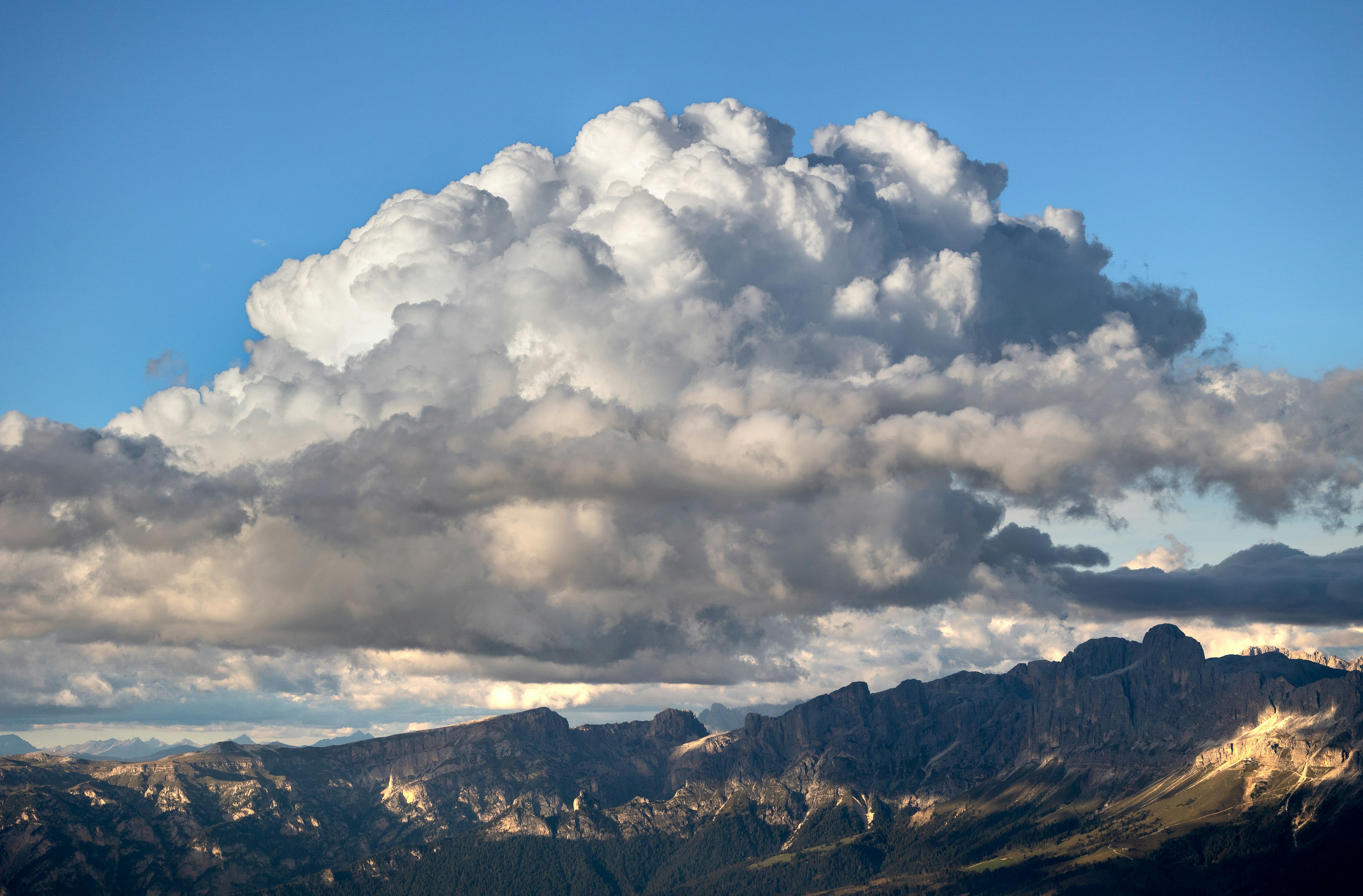 Cloud Crown Over Rugged Peaks at Blue Hour