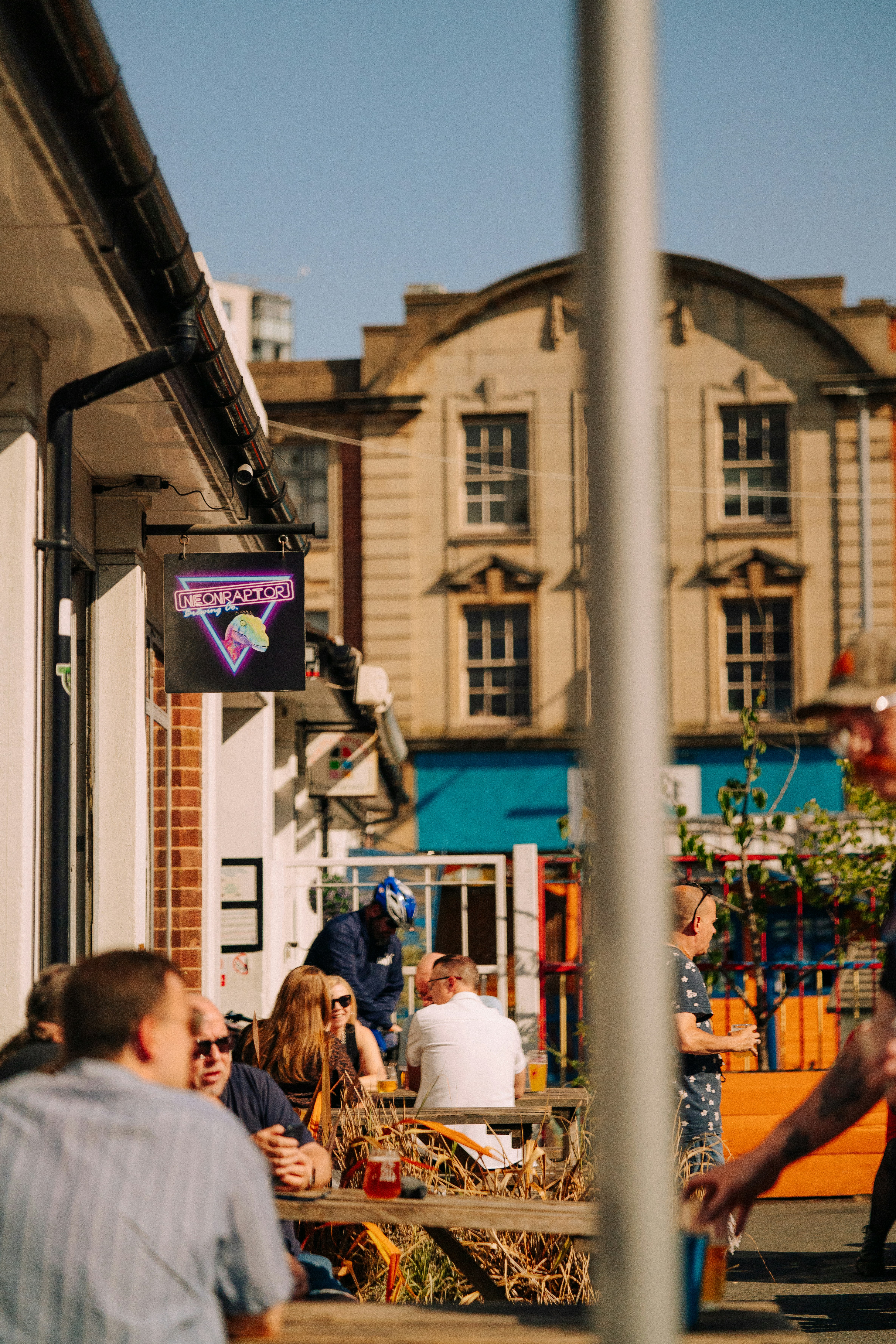 Sunlit Terrace Sociability under Urban Facades