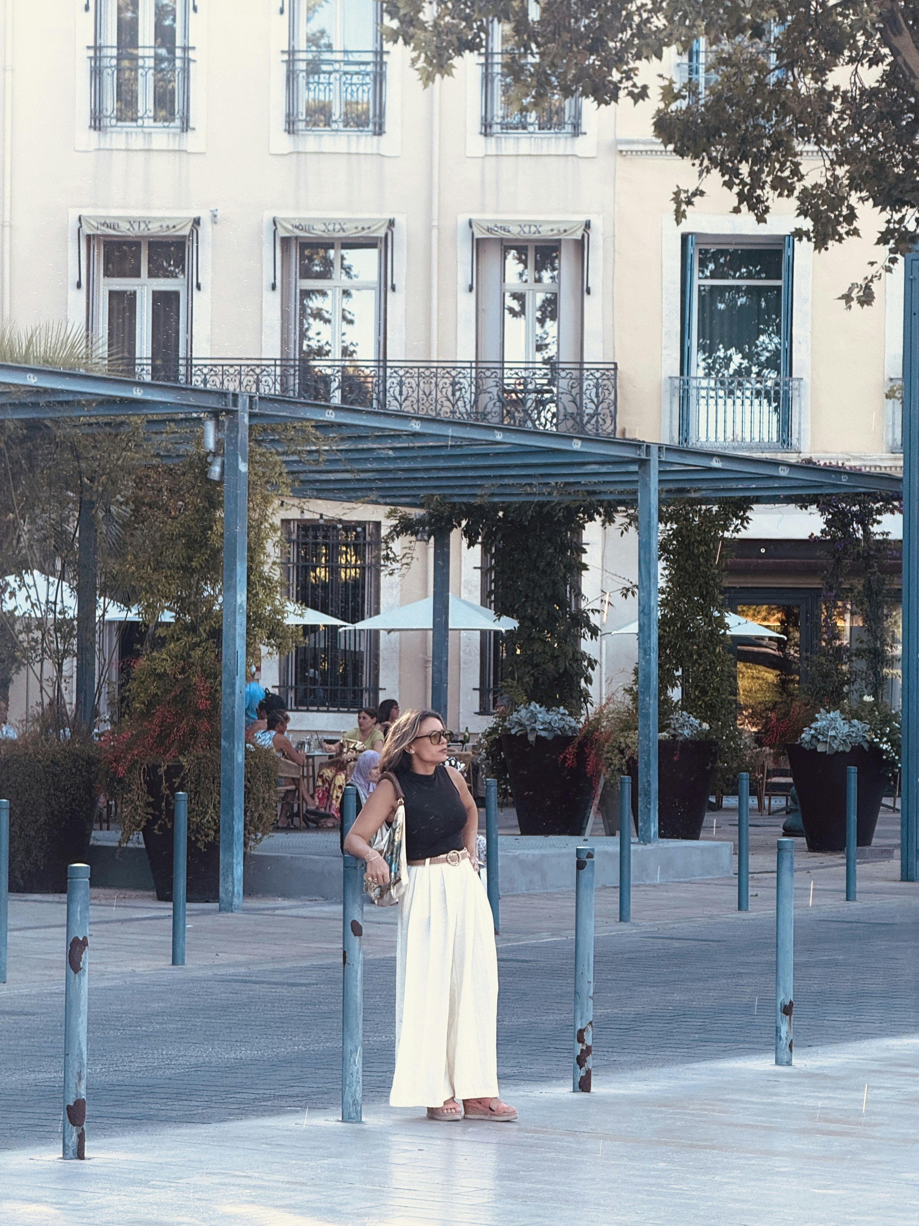 Sunlit in a Parisian Courtyard: Woman in White and Black