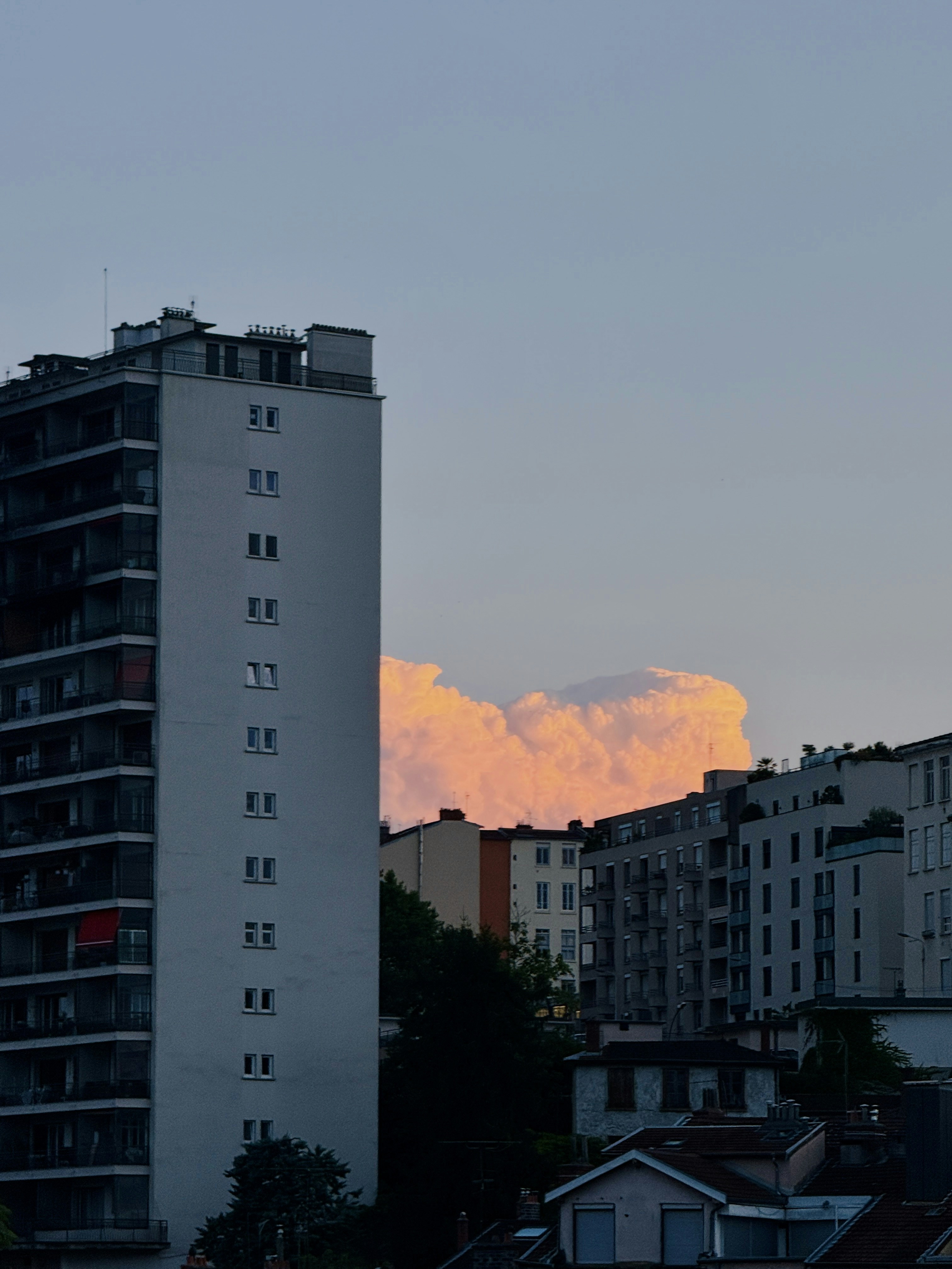 Sunlit Cloud Crest Over the City