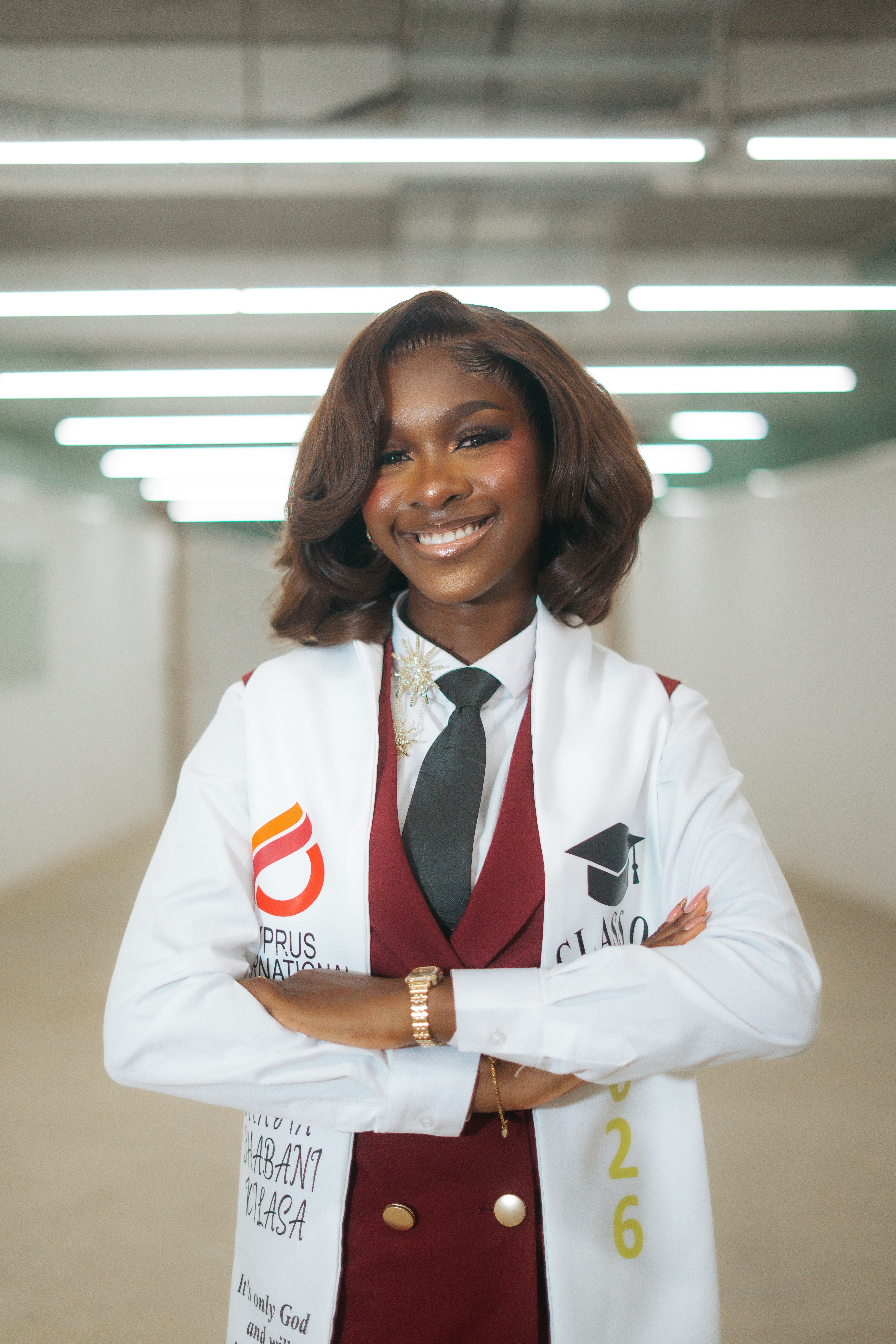 Graduate in White: Confidence in a Neonlit Corridor
