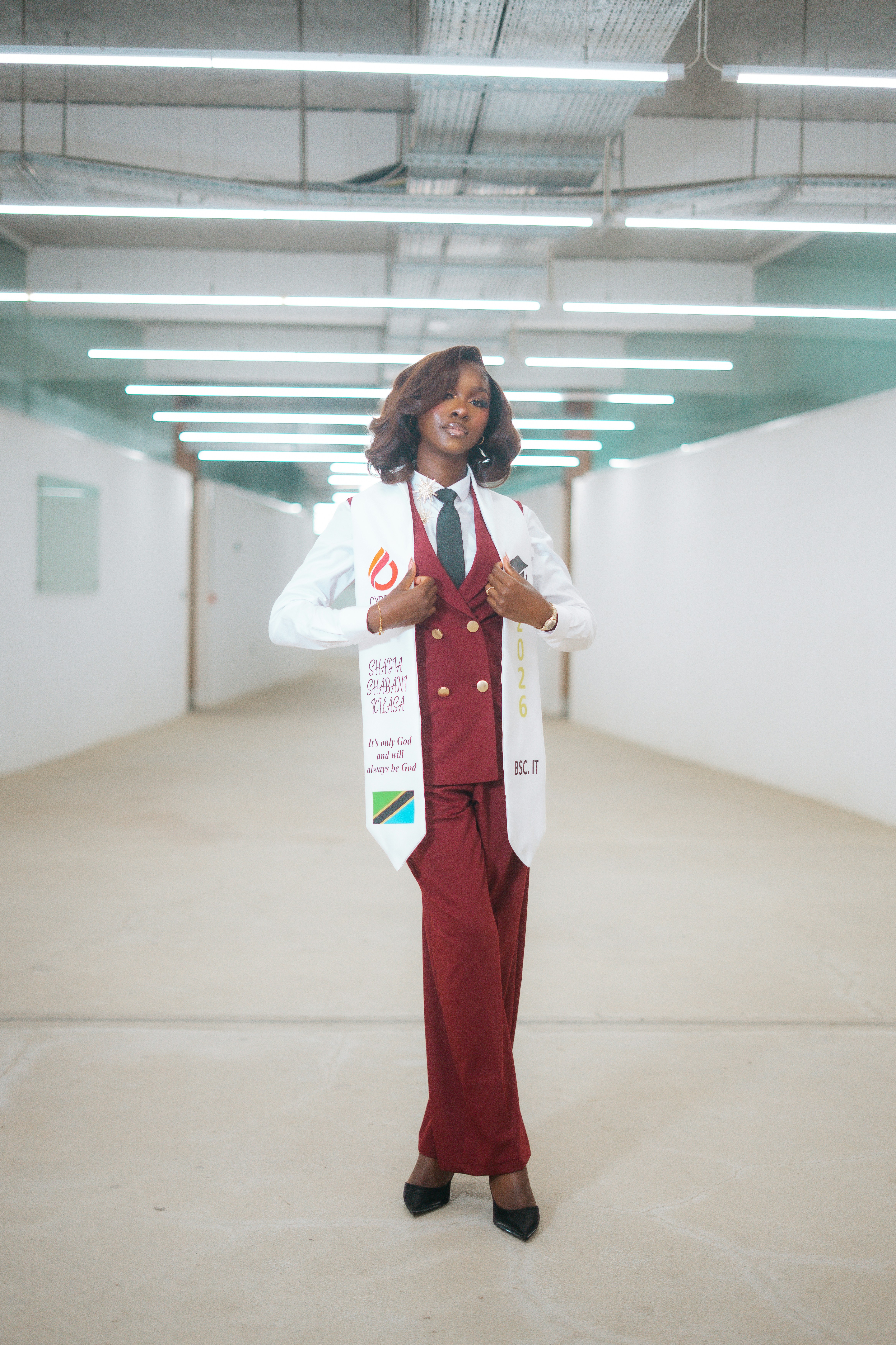 Graduate in Red: A Portrait in an Industrial Hall