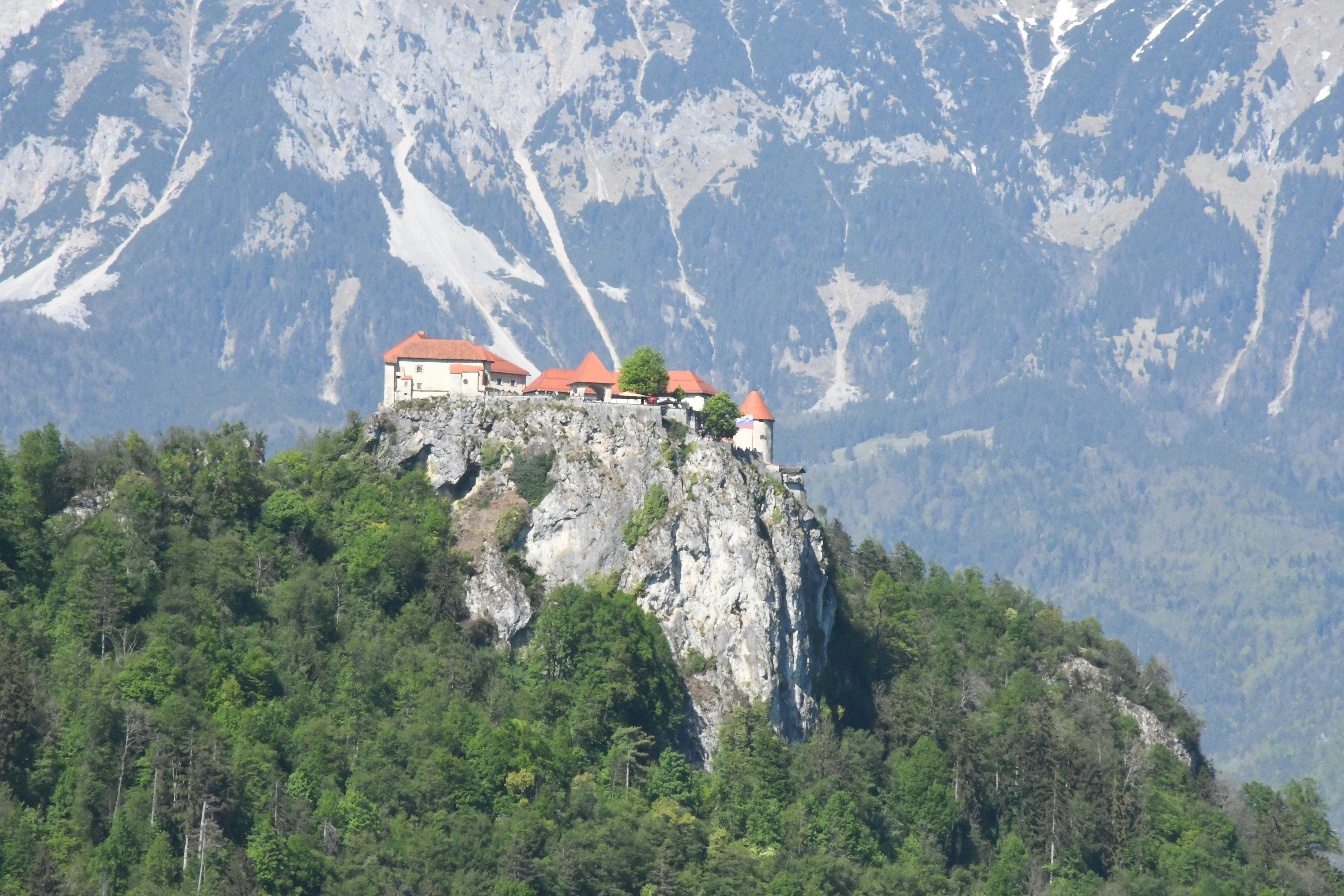 Castle on the Cliff: A Tiny Citadel Against Towering Peaks