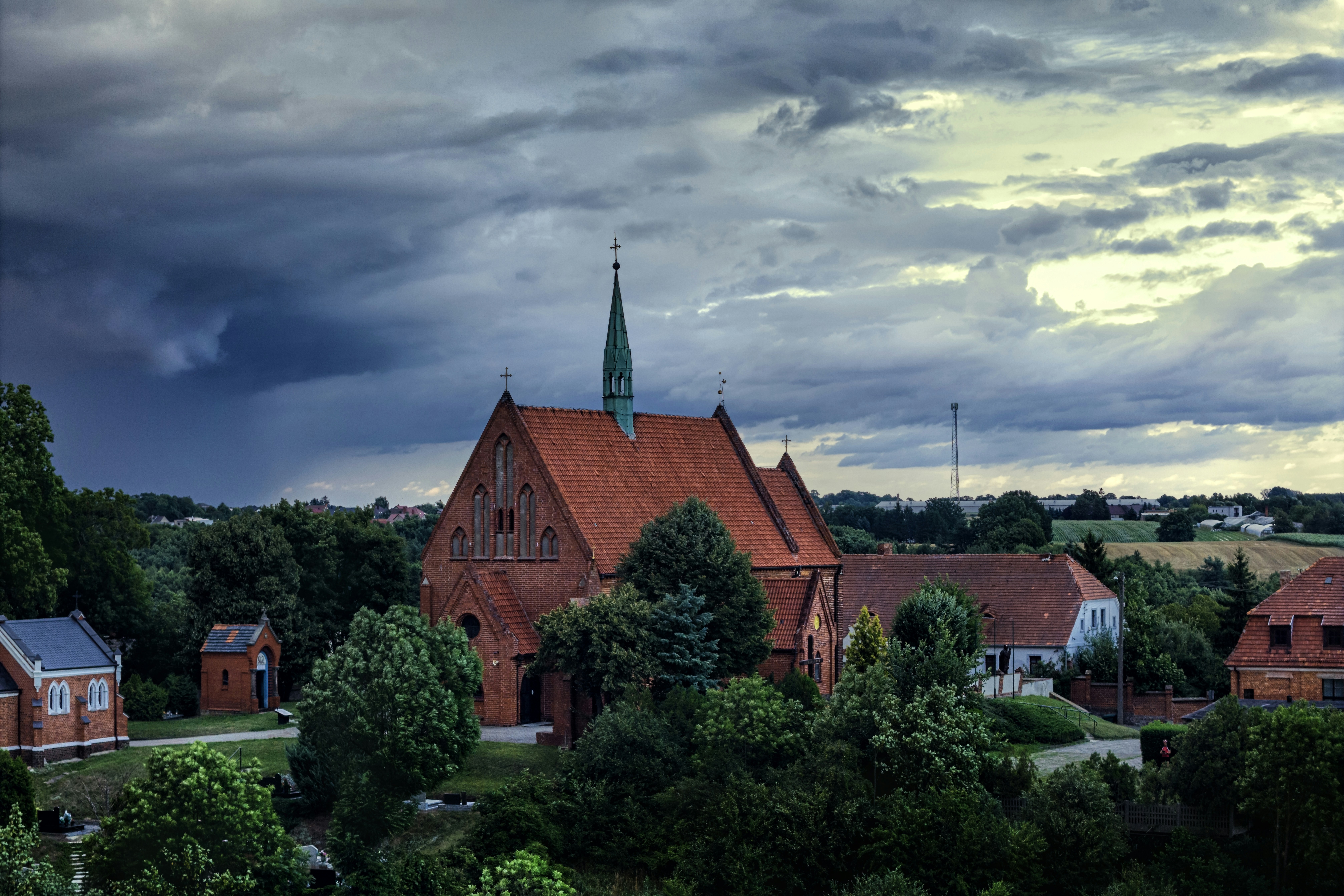 Red-roofed Church amid Verdant Village