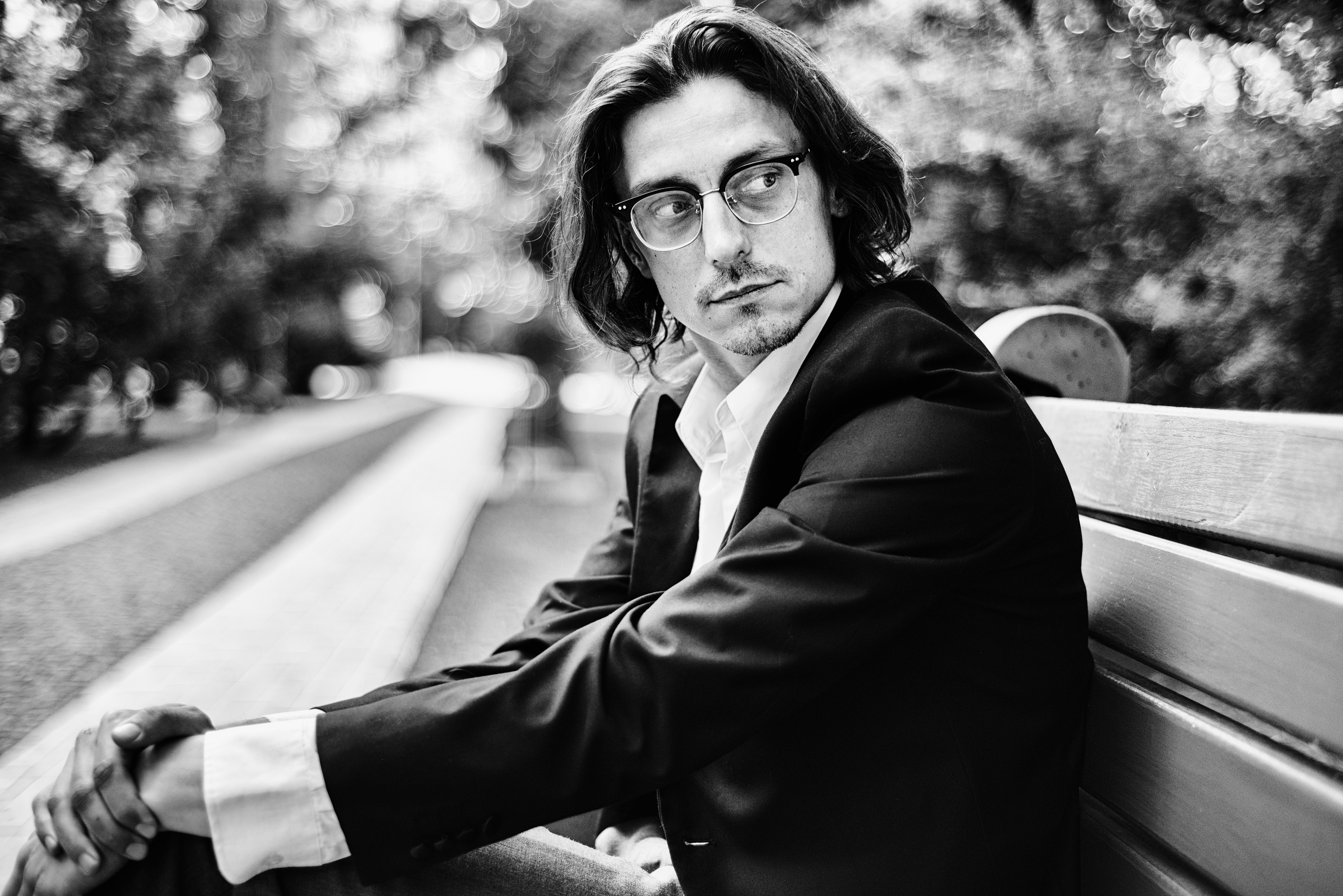 Portrait on a Park Bench: Quiet Confidence in Mono