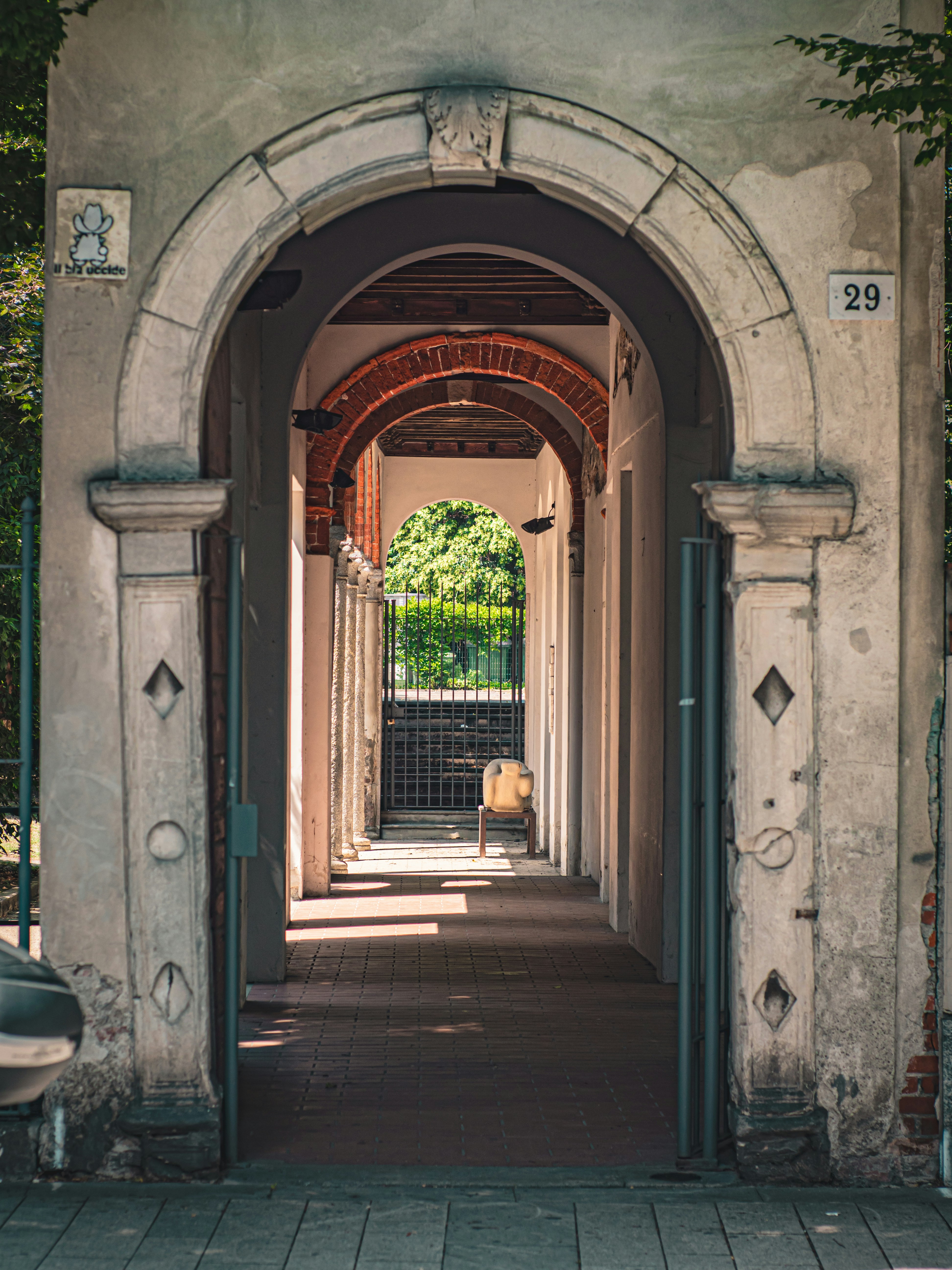 Archway Corridor to a Sunlit Courtyard