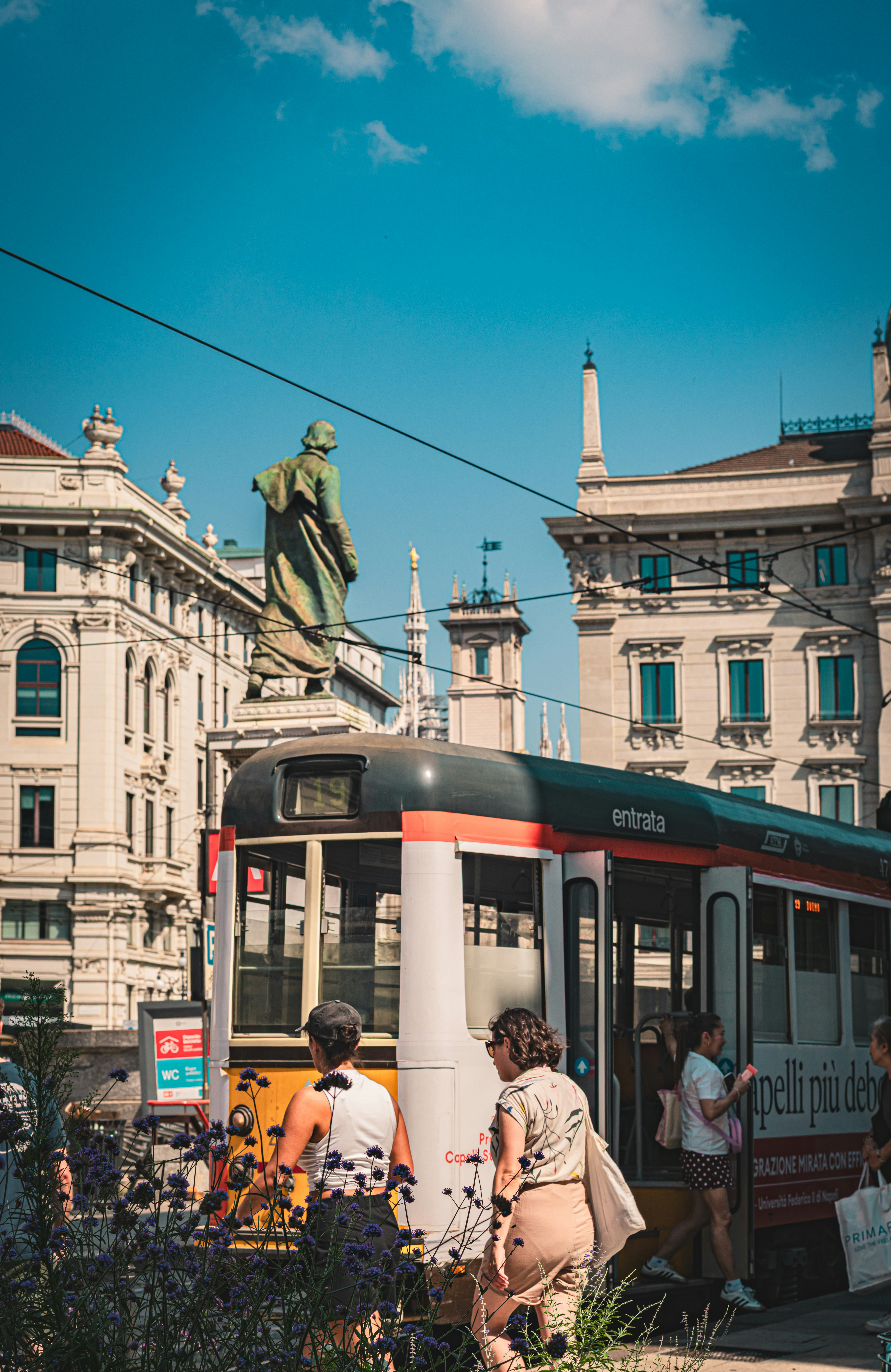 Urban Tram and Sunlit Facades: A Day in the Square