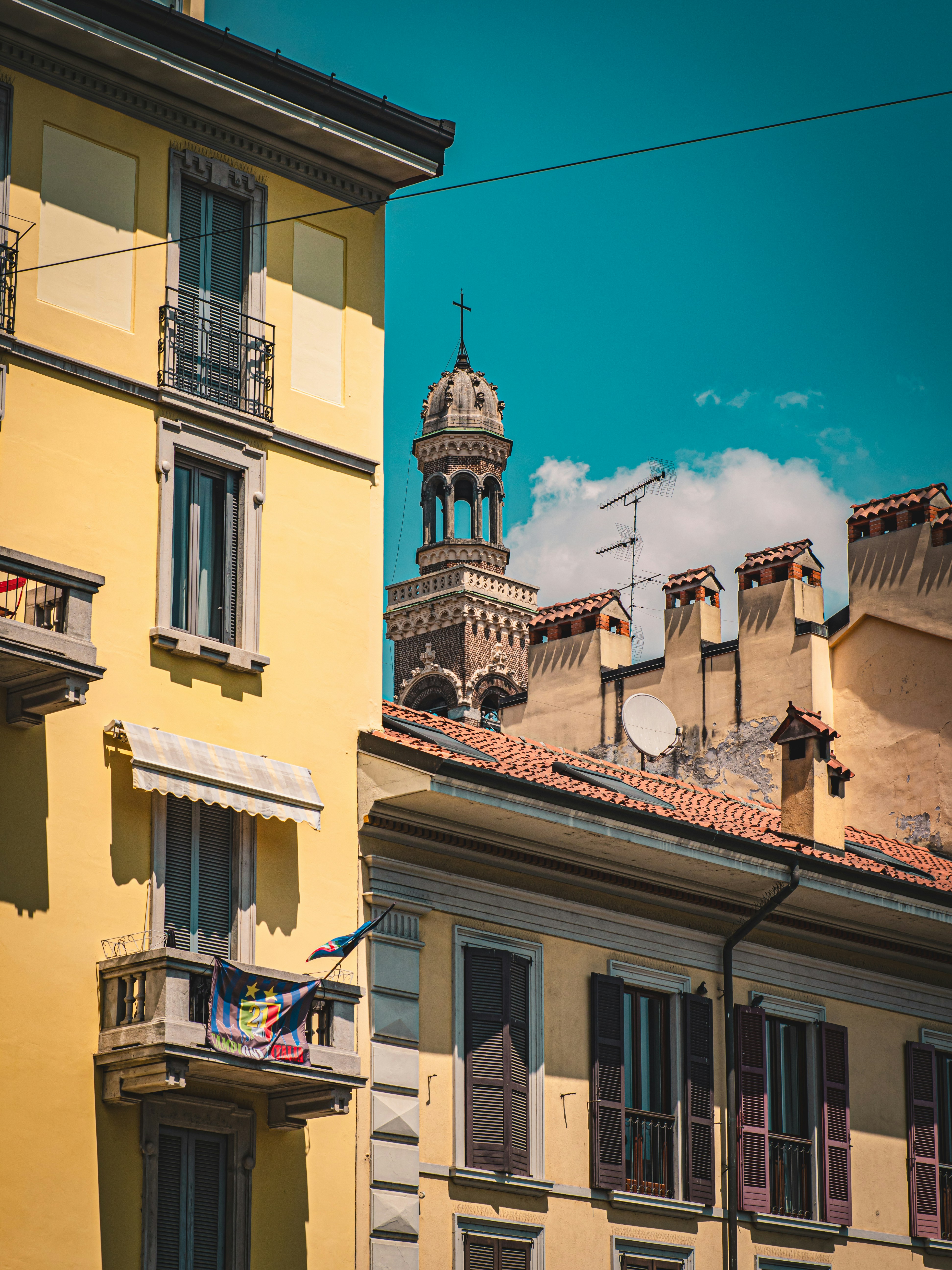 Sunlit Facades and a Timed Tower Peak