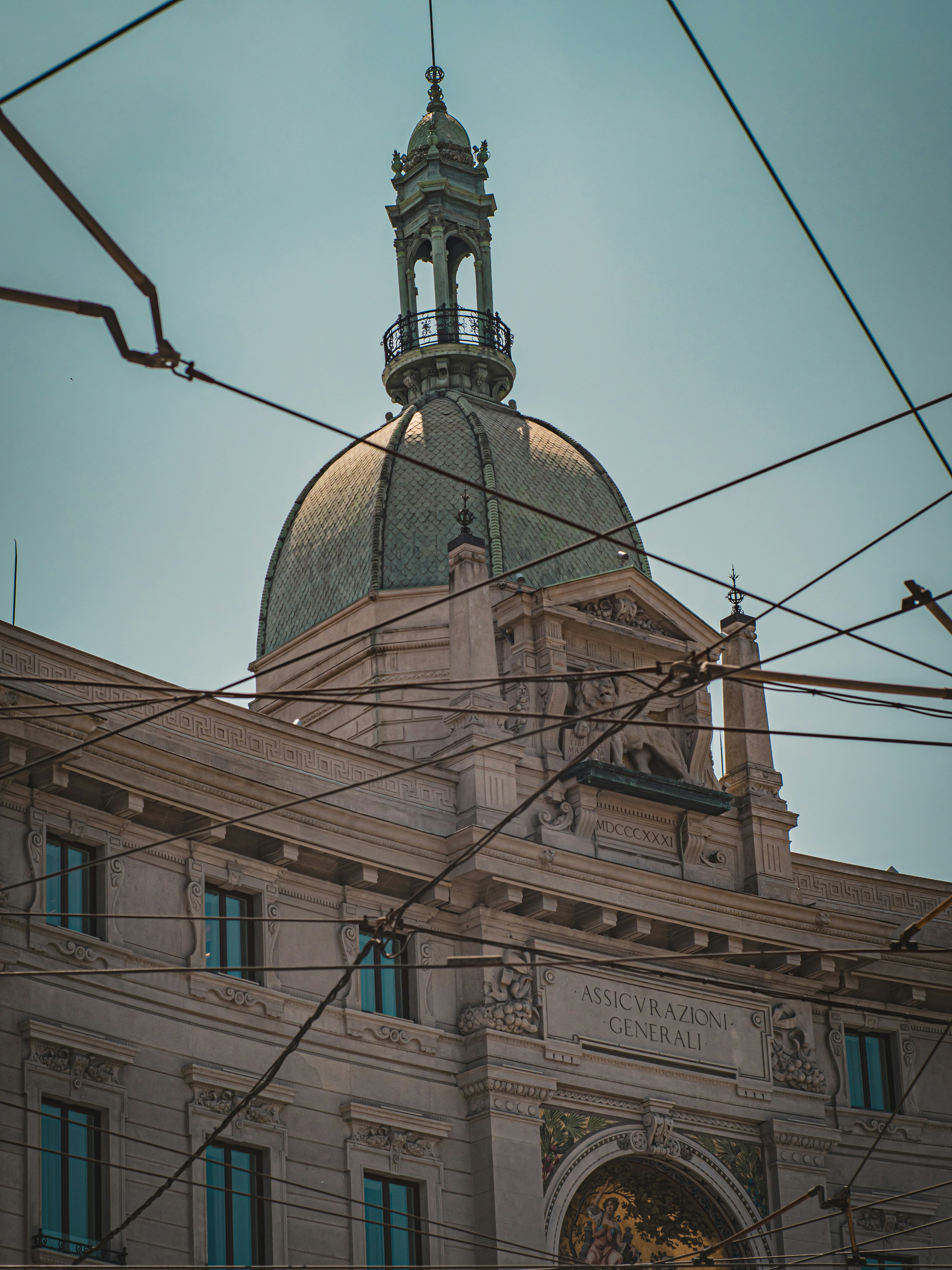 Architectural Dome Strands: A Tangle of Tram Cables Over a Historic Facade