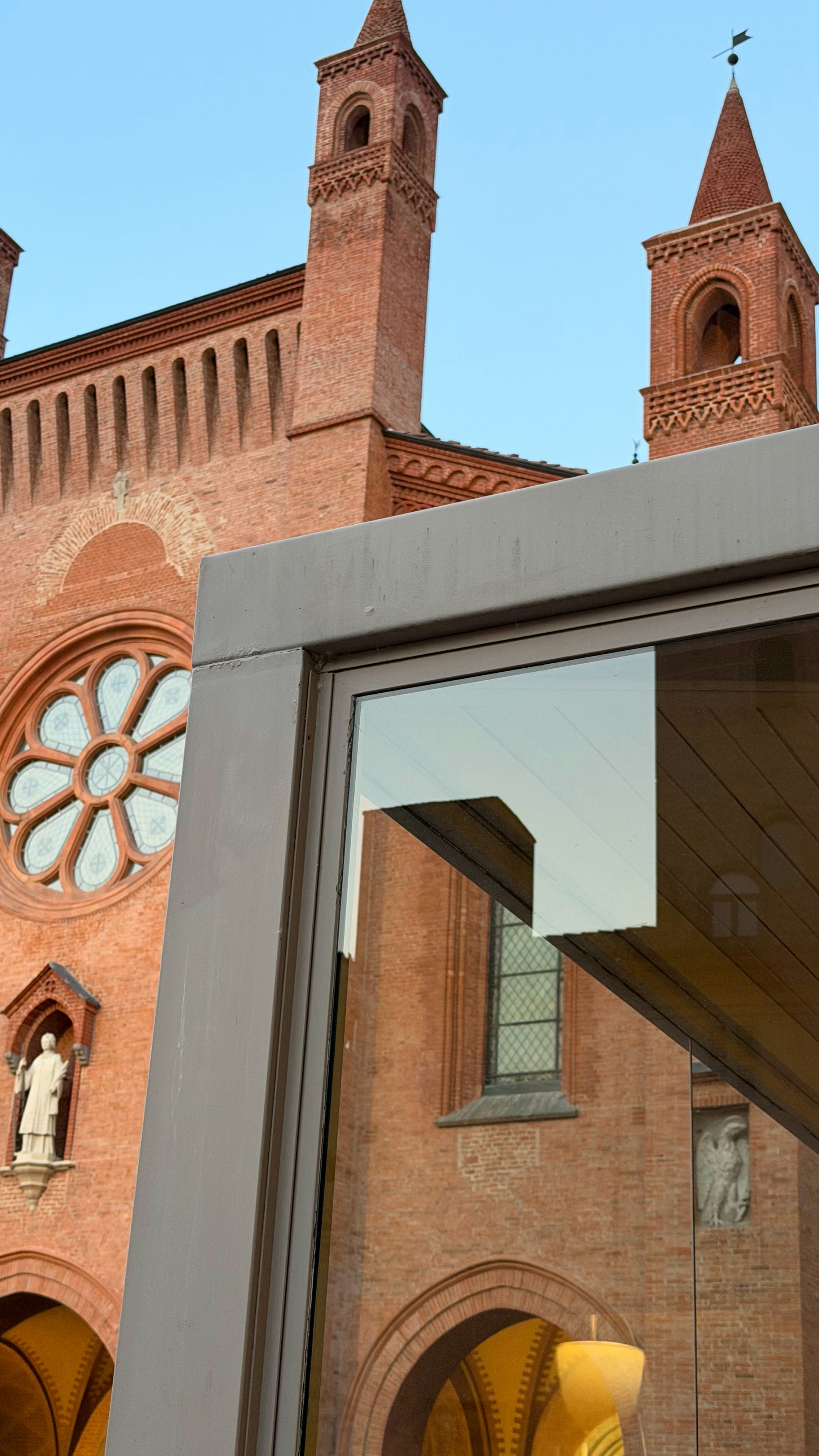 Reflected Architecture: Glass and Brick Meet Gothic Facades