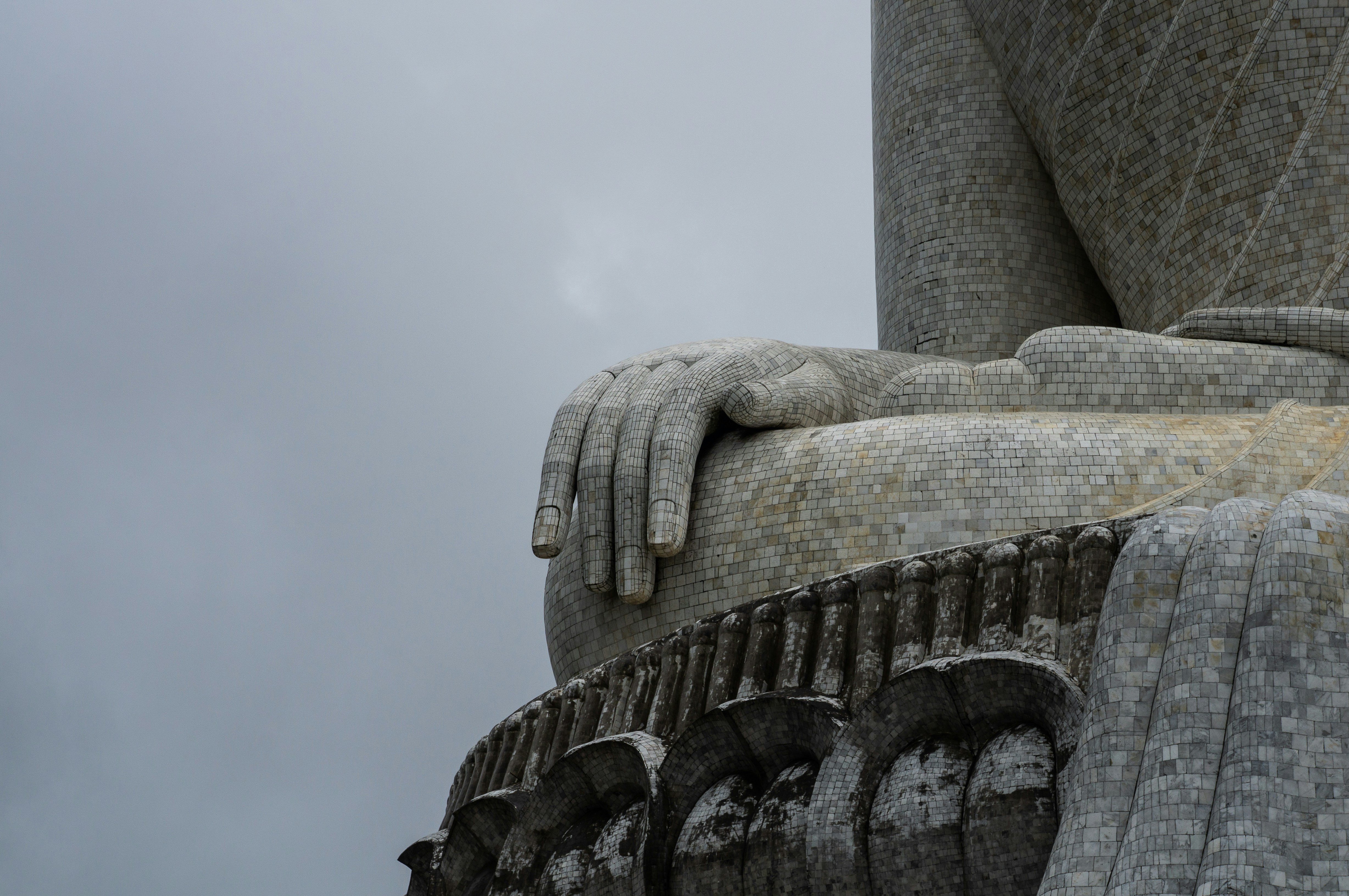 Stone Sentinel: The Hand and Base of a Monument