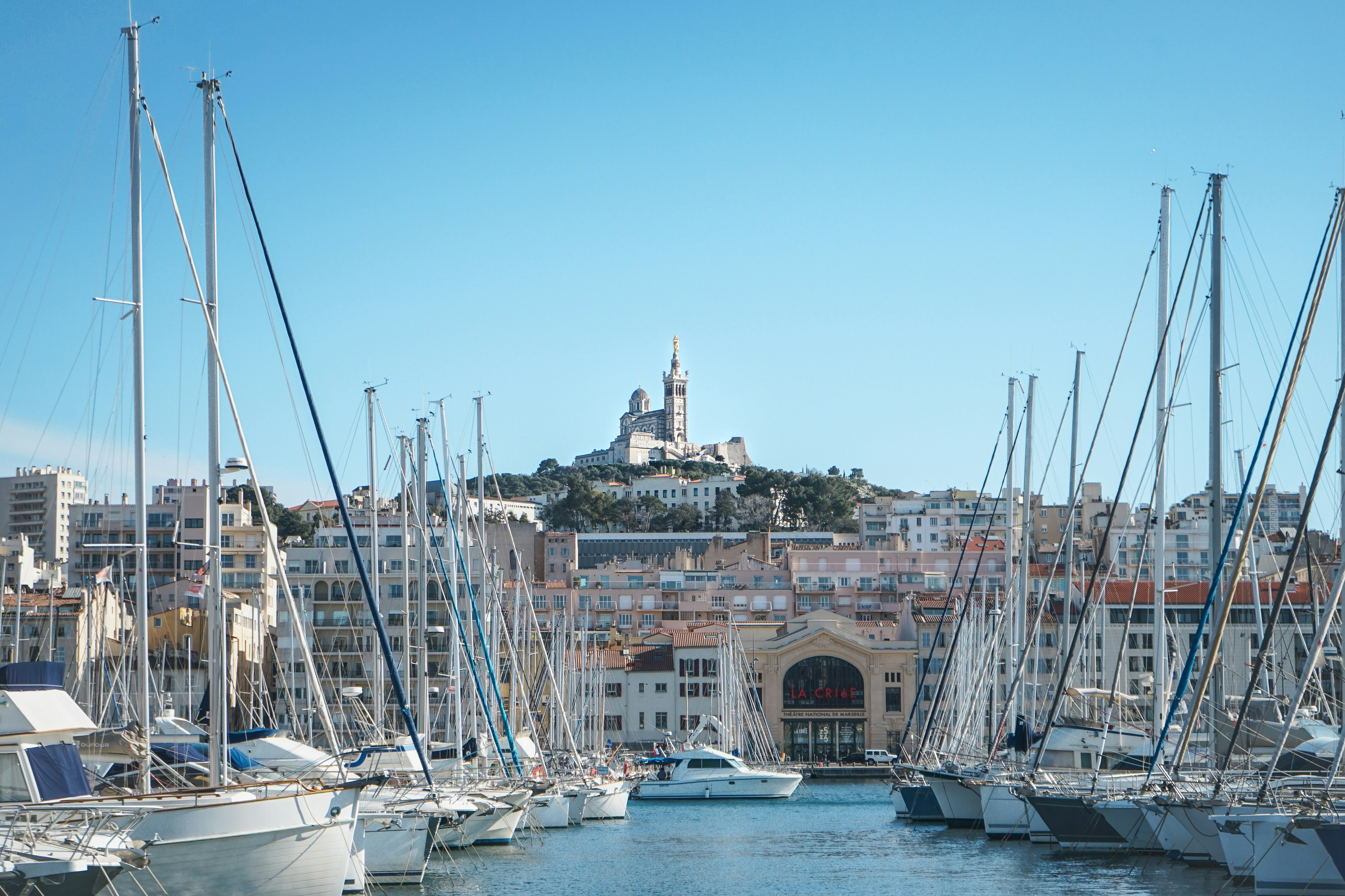 Marina Mosaic: Sails Framing a Historic Climb