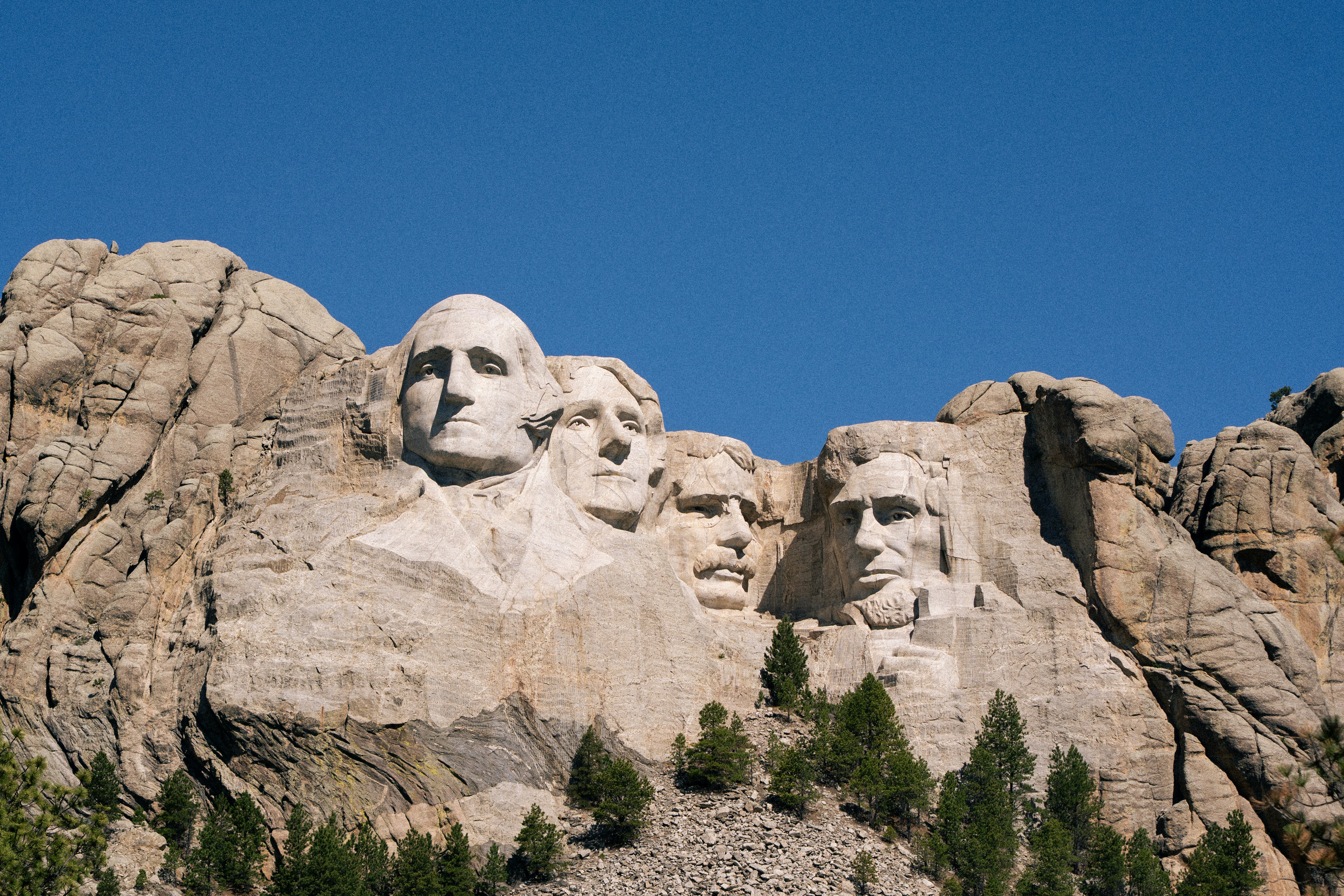 Stone Portraits Under a Clear Blue Sky