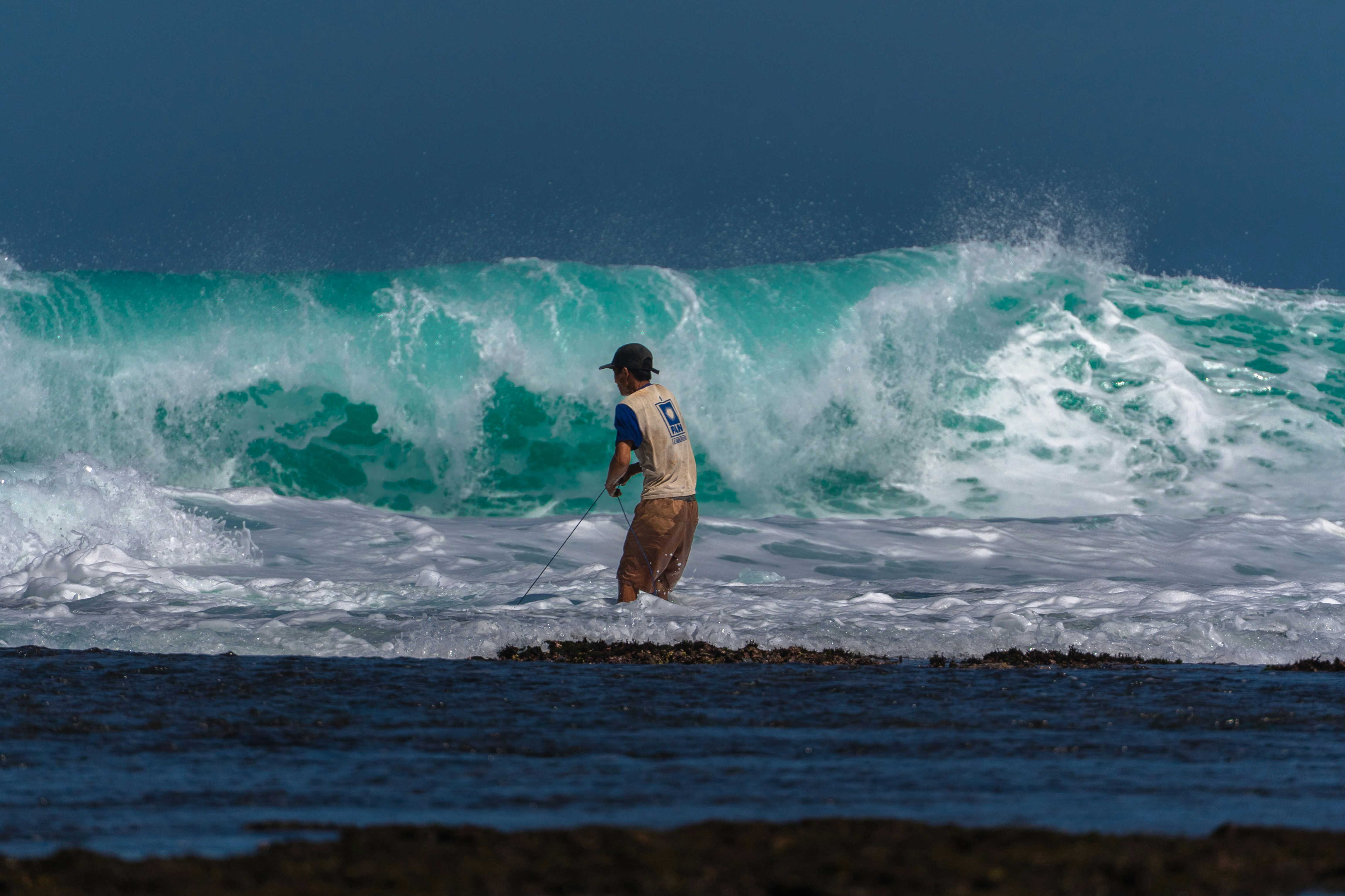 Stand in the Breaker: A Surfer’s Moment Beneath a Turquoise Wave