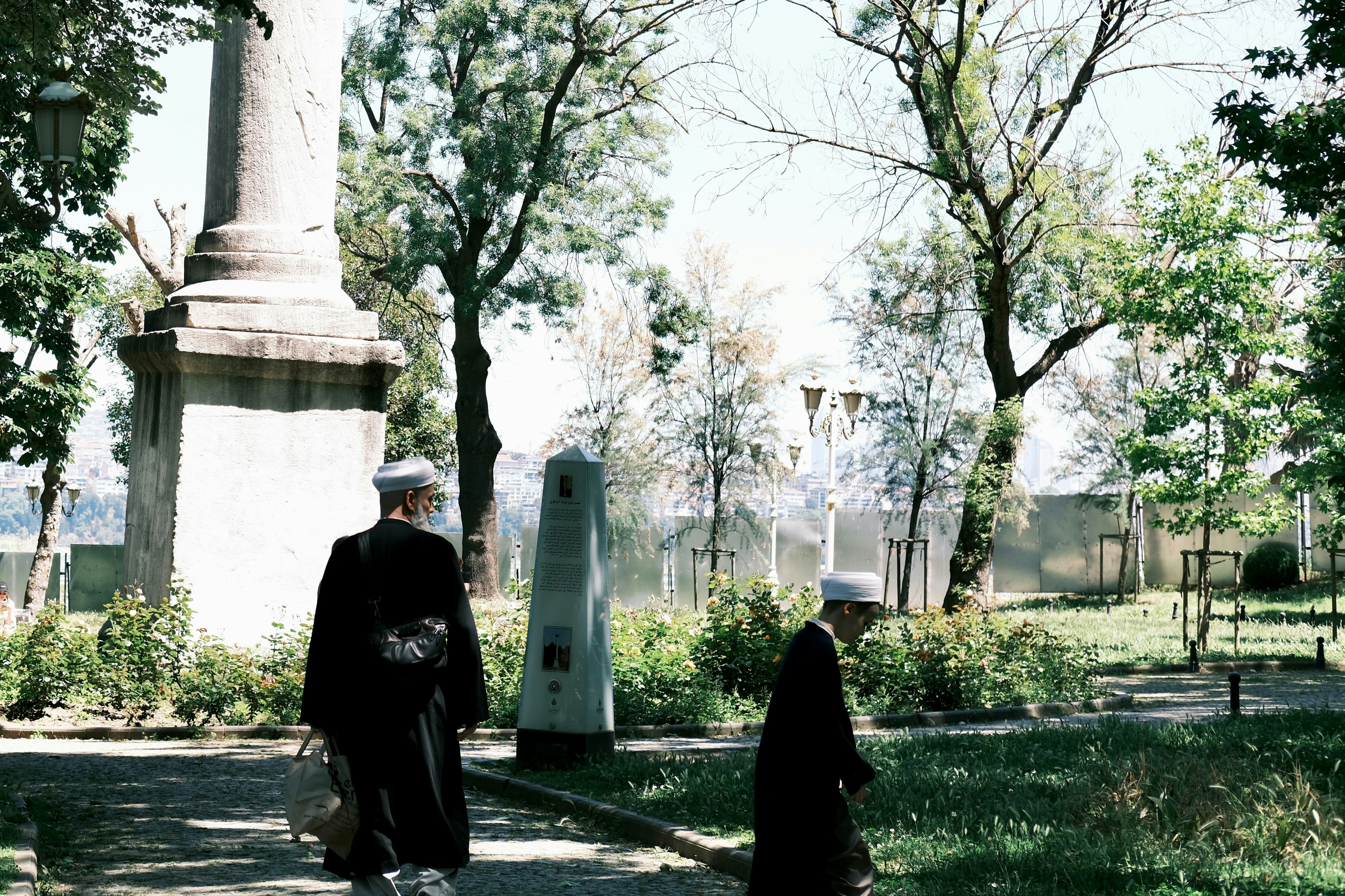 Quiet Prayers in the Park: Two Women Under the Monumental Shade
