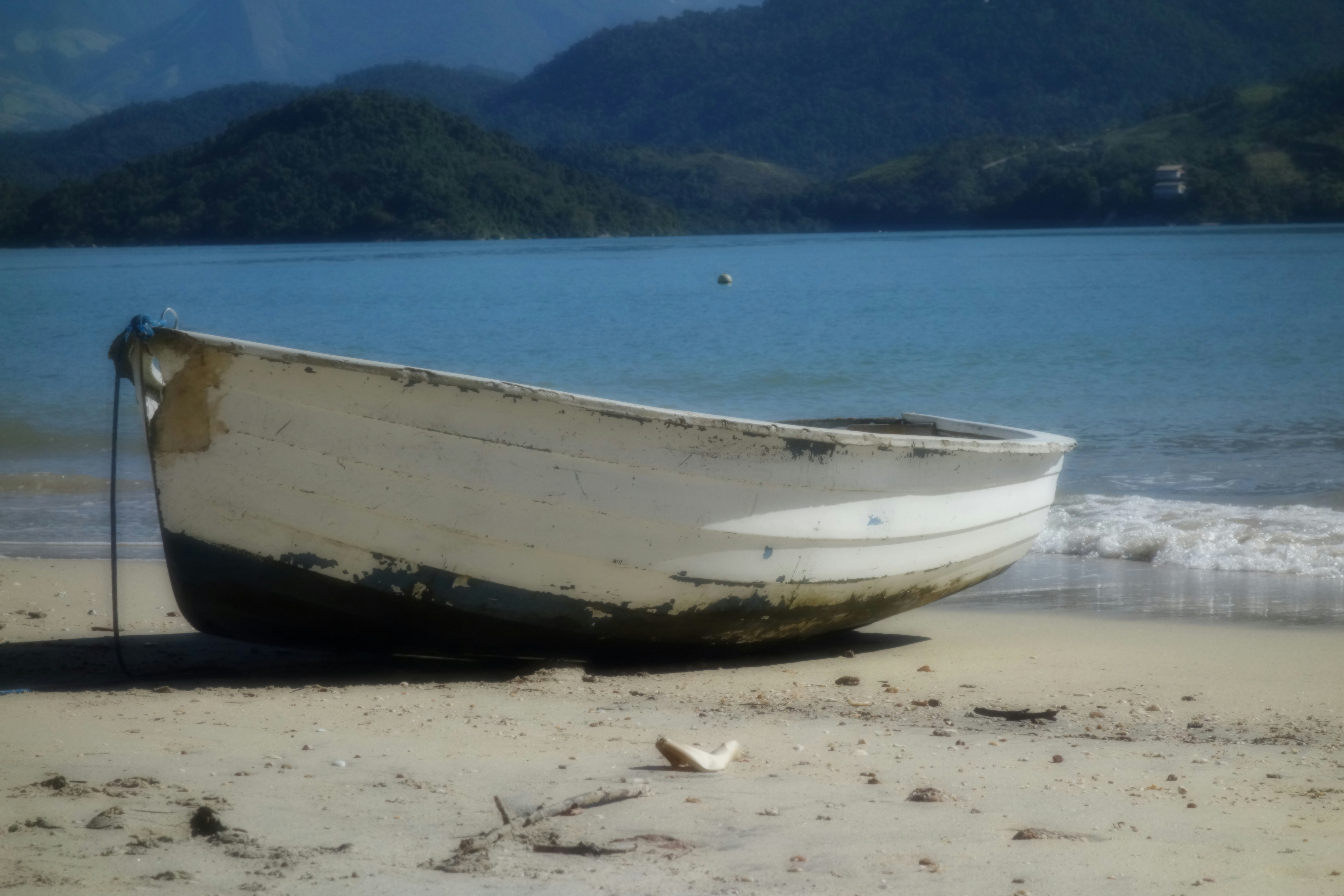 Lonely Boat Resting on Quiet Shore at Dusk