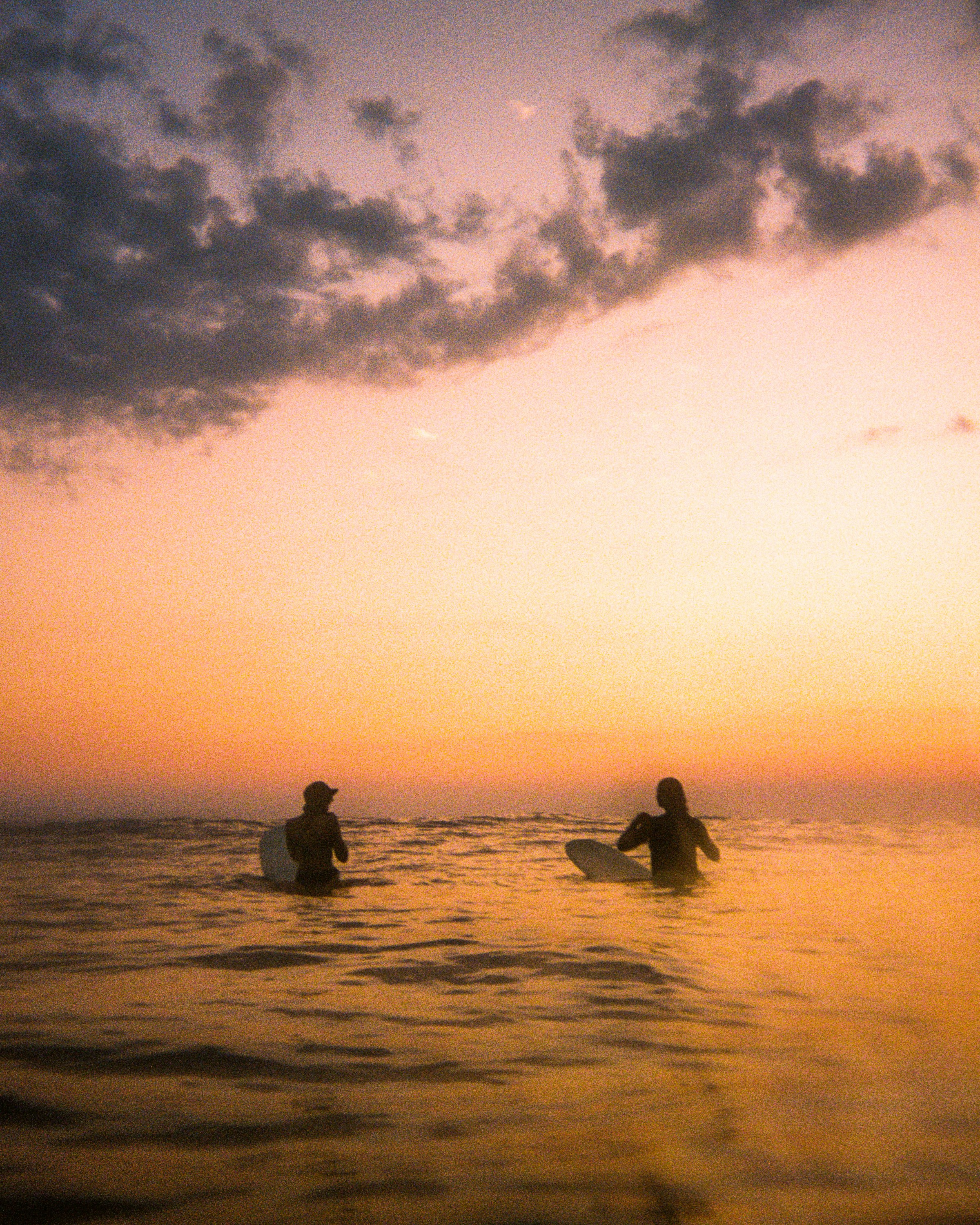 Dawn Interlude: Surfers at the Quiet Edge of Daybreak