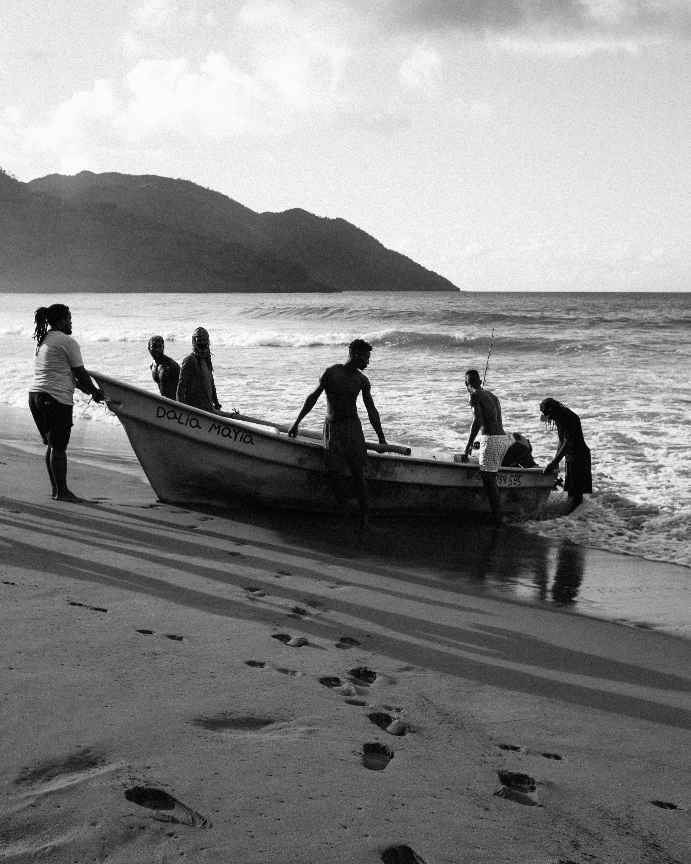 Boat and Fishermen at Dusk: A Quiet Shoreline Ritual