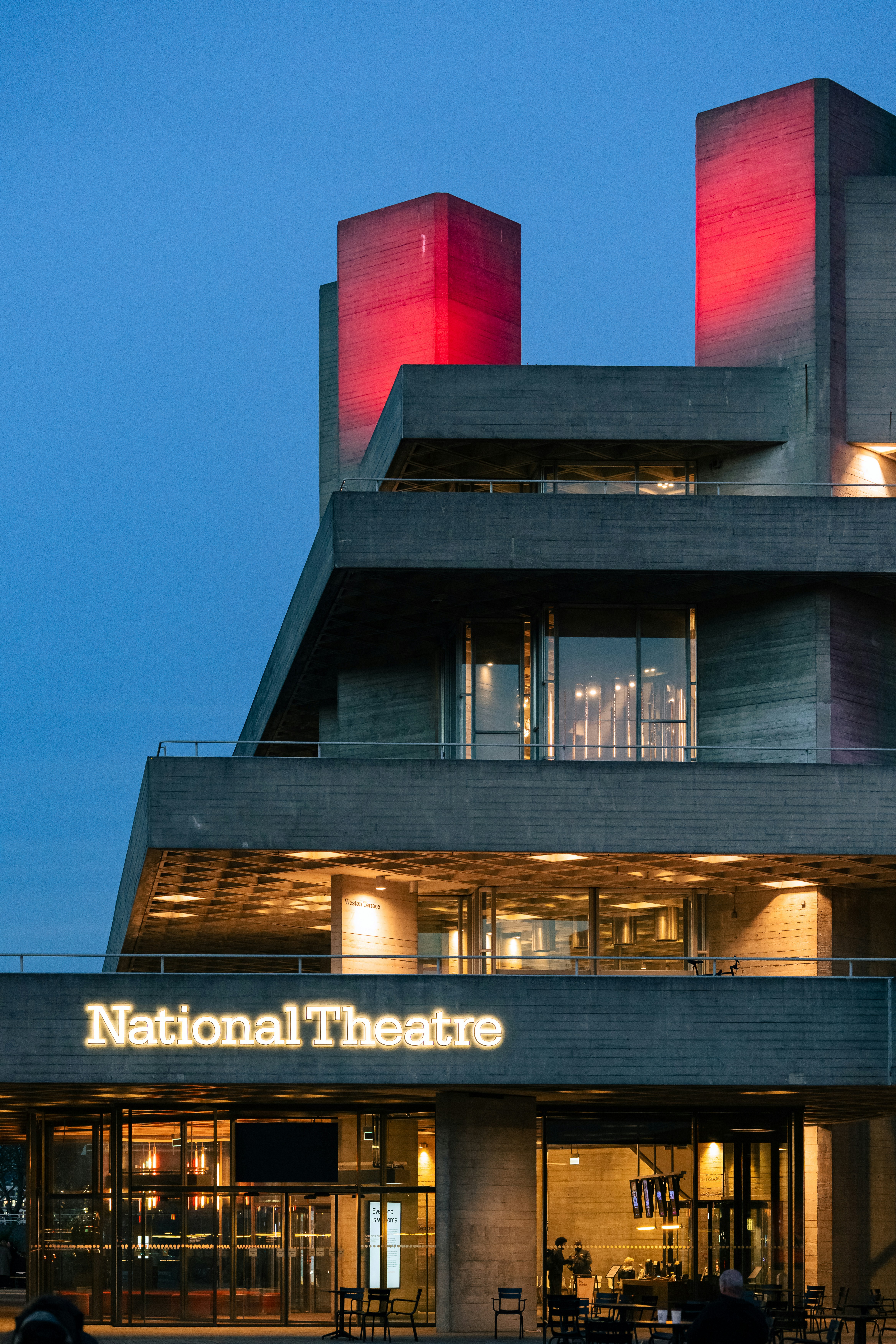 National Theatre Facade at Dusk with Red Tower Accents