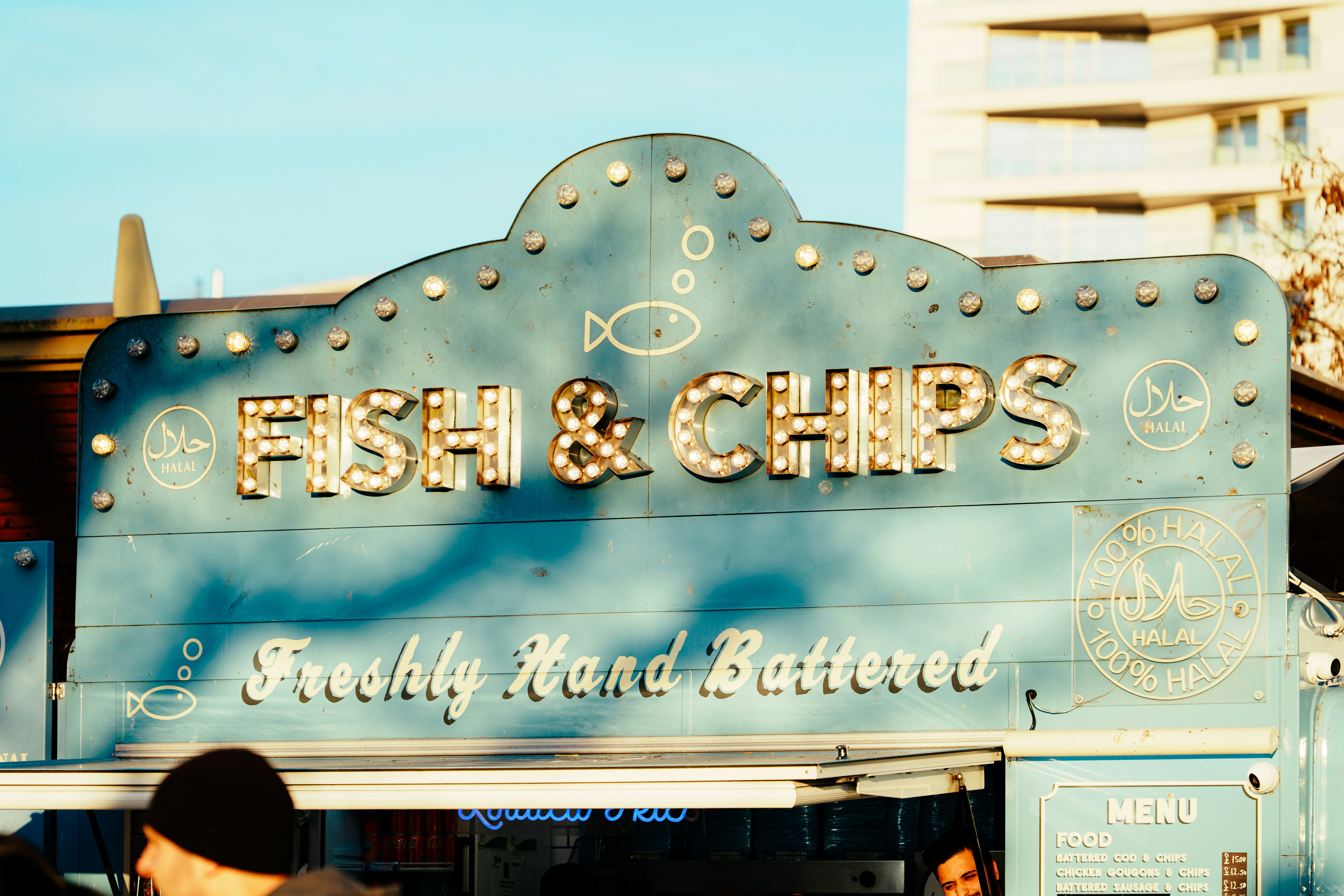 Neon Soaked Signage: Freshly Hand Batterered Fish & Chips Stand