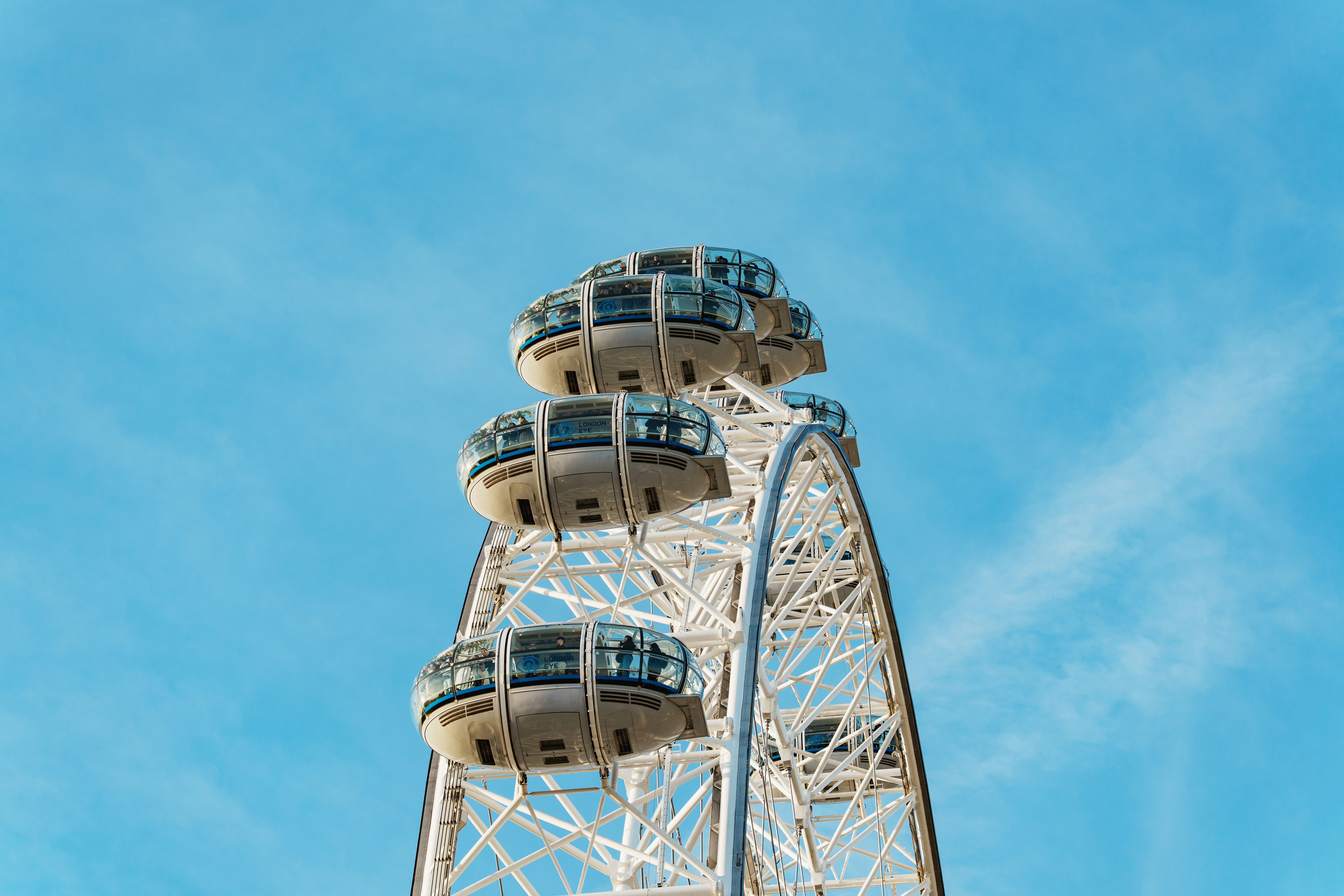 Skyward Capsule: Aerial Wheels Against a Clear Blue Canvas