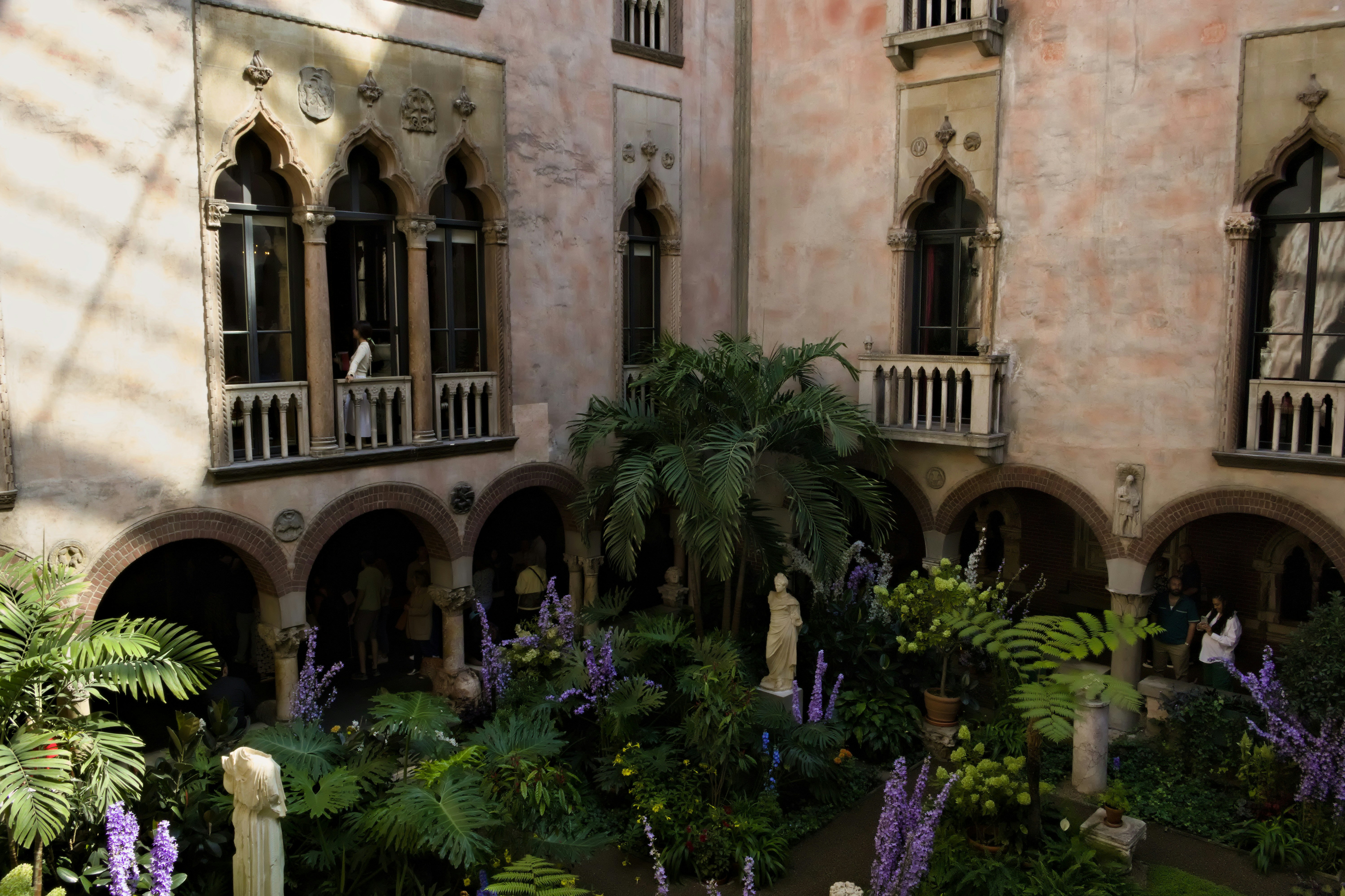 Courtyard Conservatory: Flowering Gallery Amid Gothic Arches