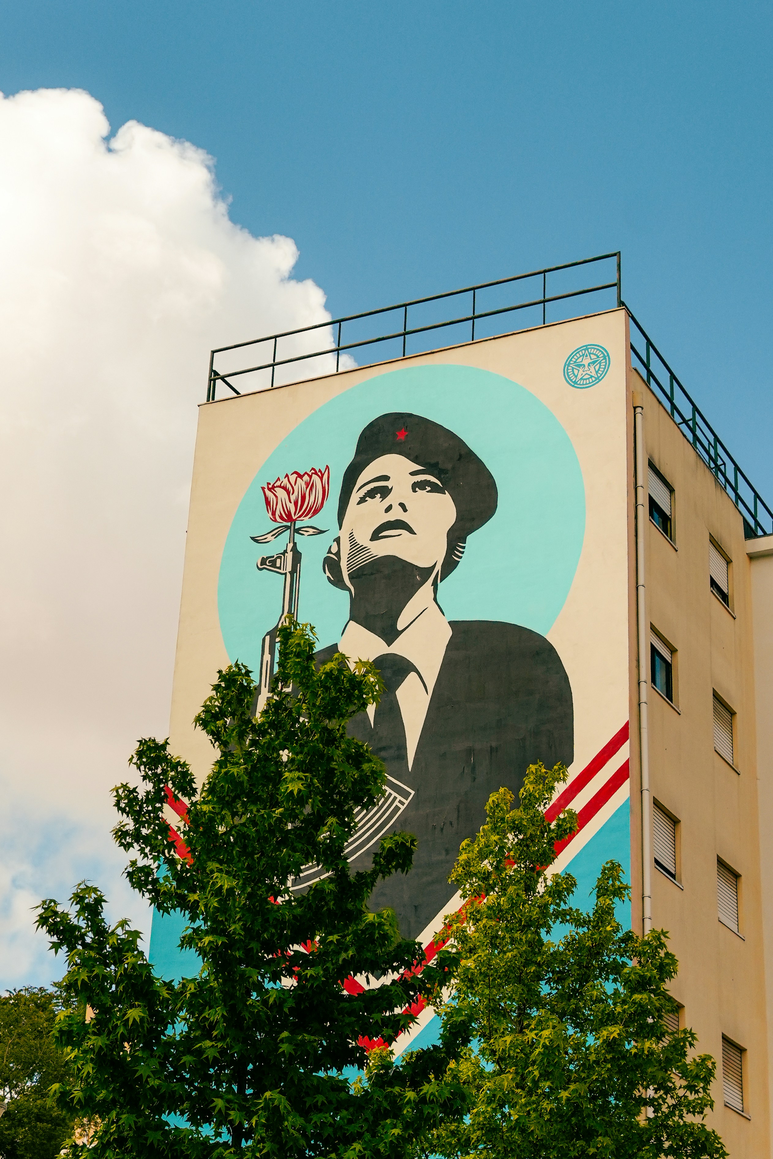 Mural of a Quiet Commander Rising Above the City