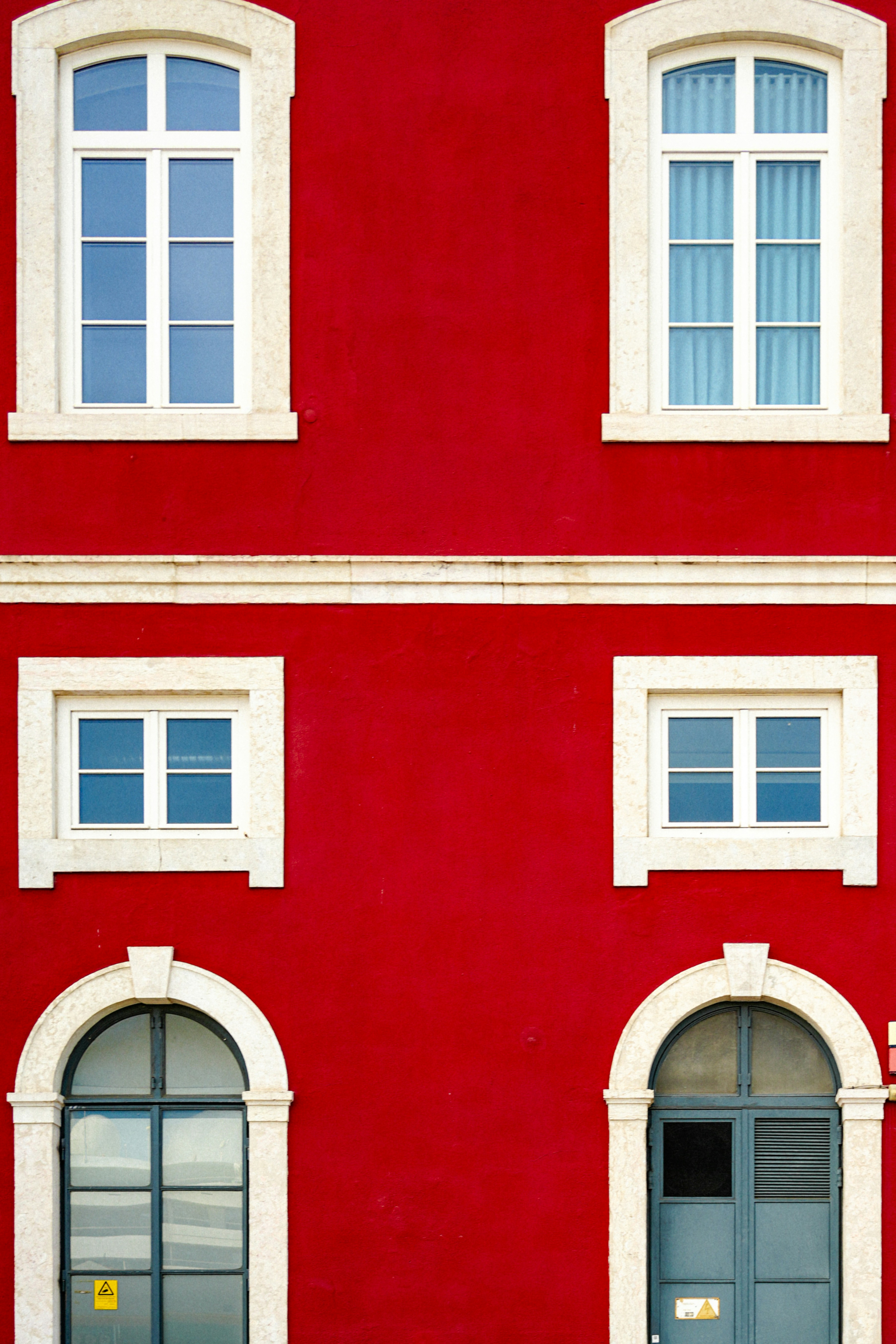 Crimson Facade: Symmetry of Light and Stone