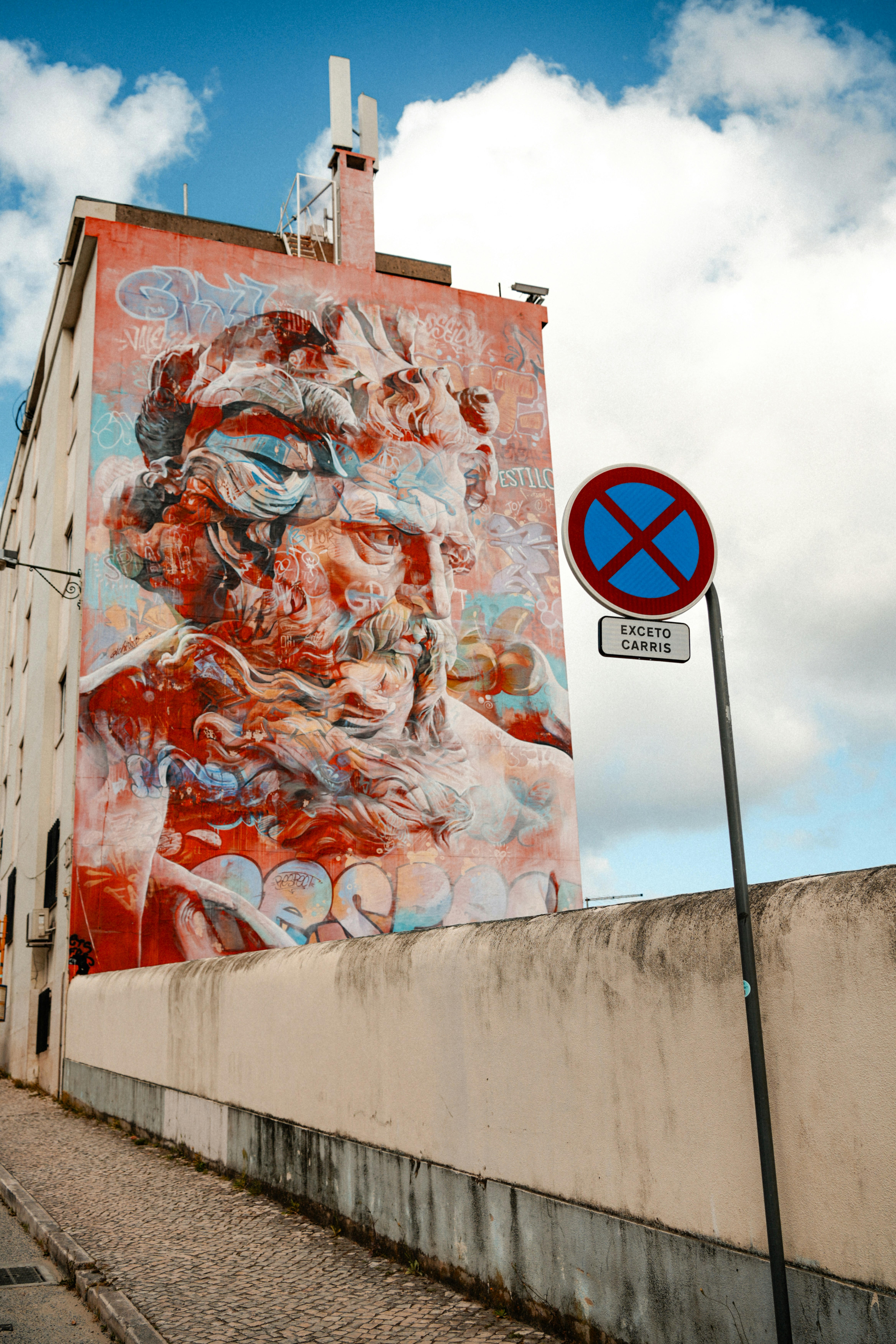 Graffiti Portrait on a Quiet Street Cast in Bright Daylight