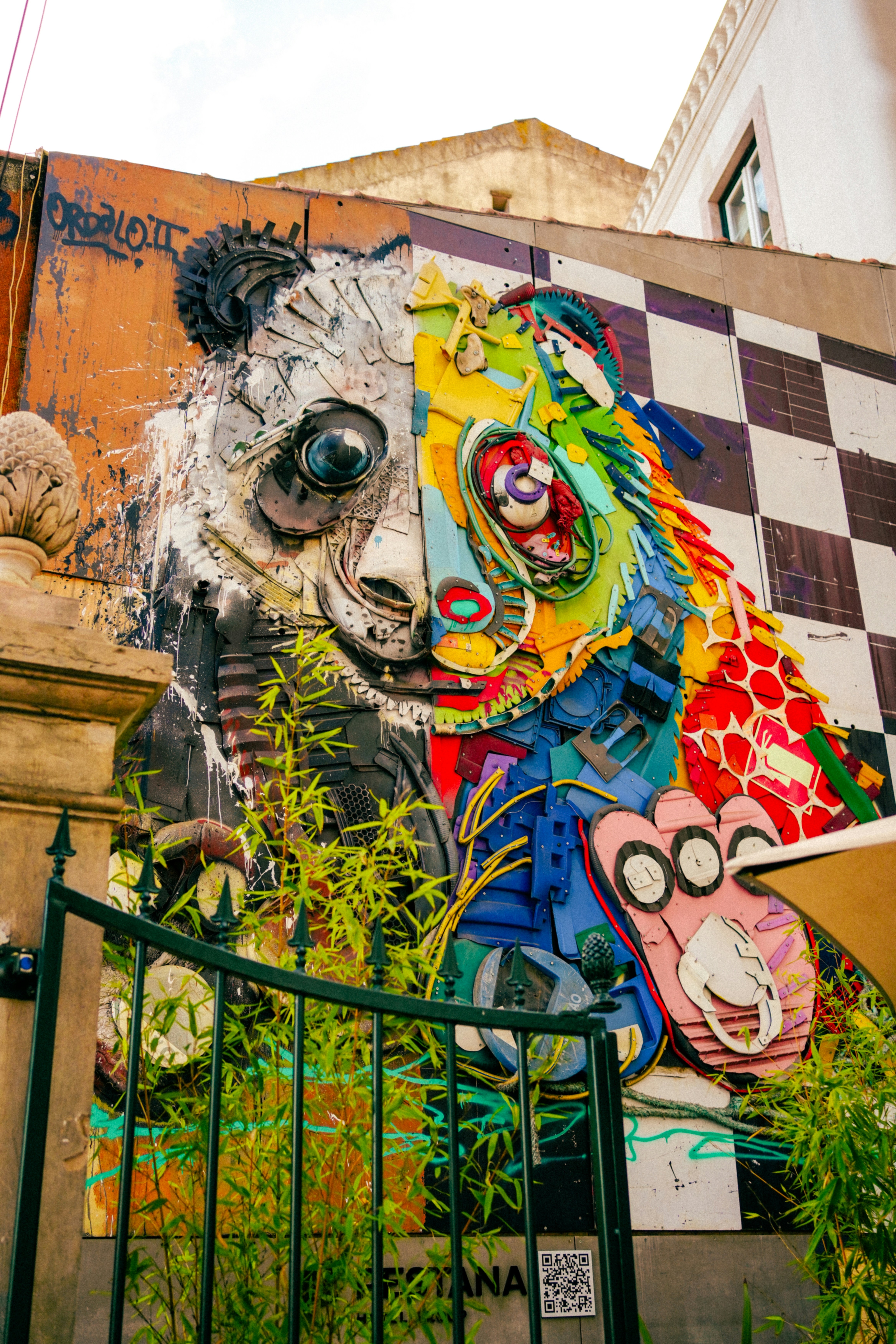 Vibrant mural of a fragmented visage crowned in color
