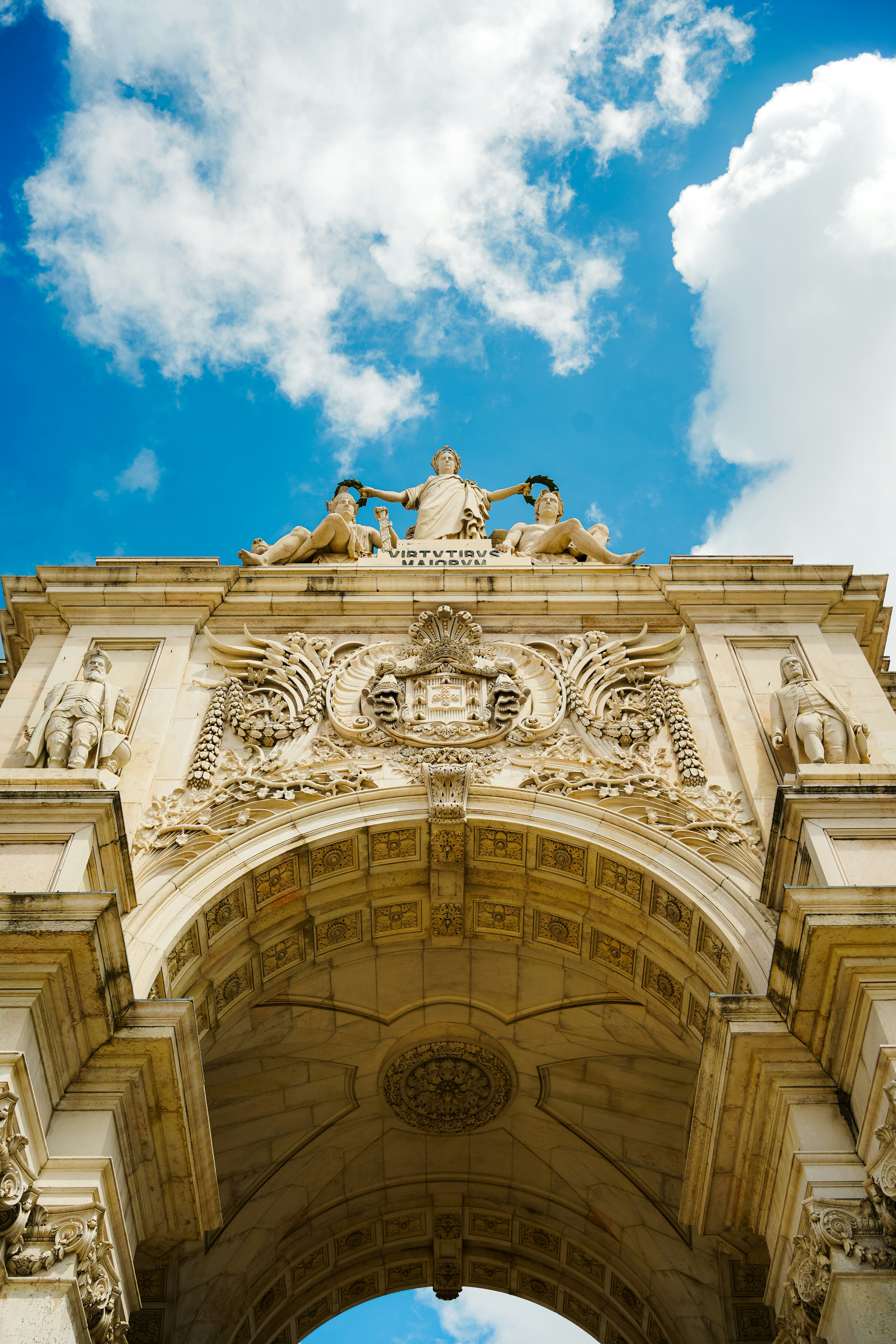 Overarching Arch: Sculpted Archway Under a Sunlit Sky