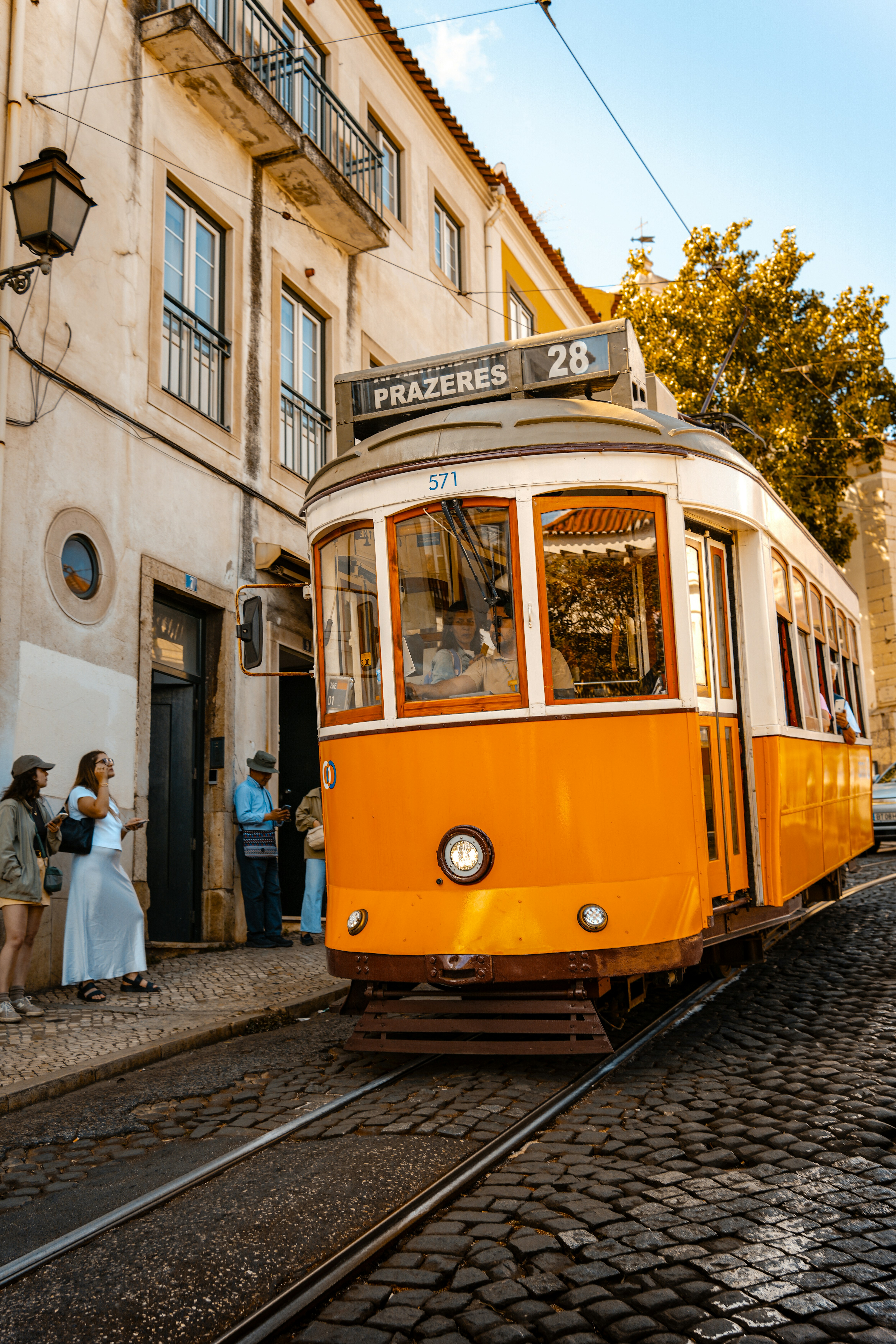 Golden Tram at a cobbled corner