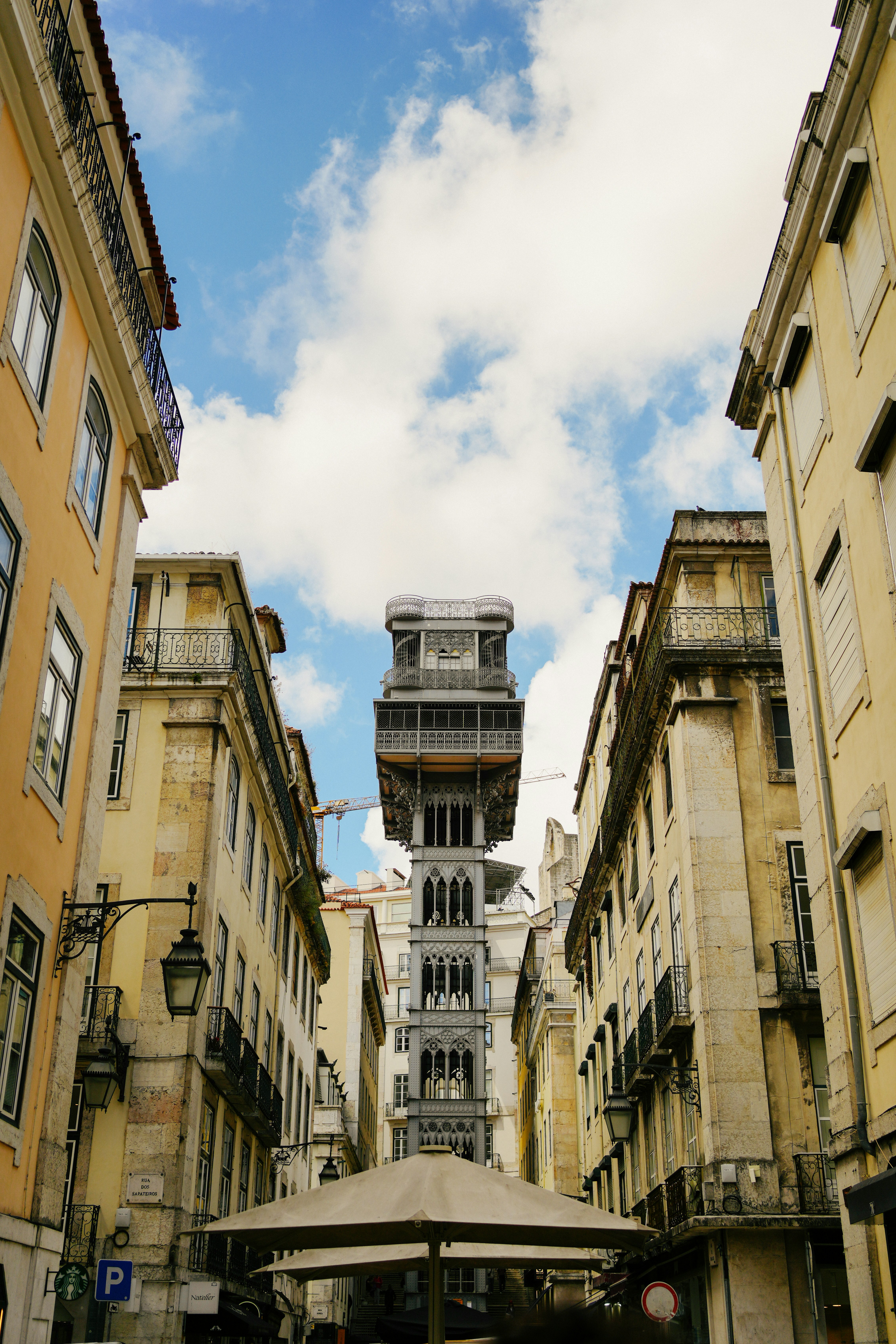 Centered Clocktower Rising Above a European Street