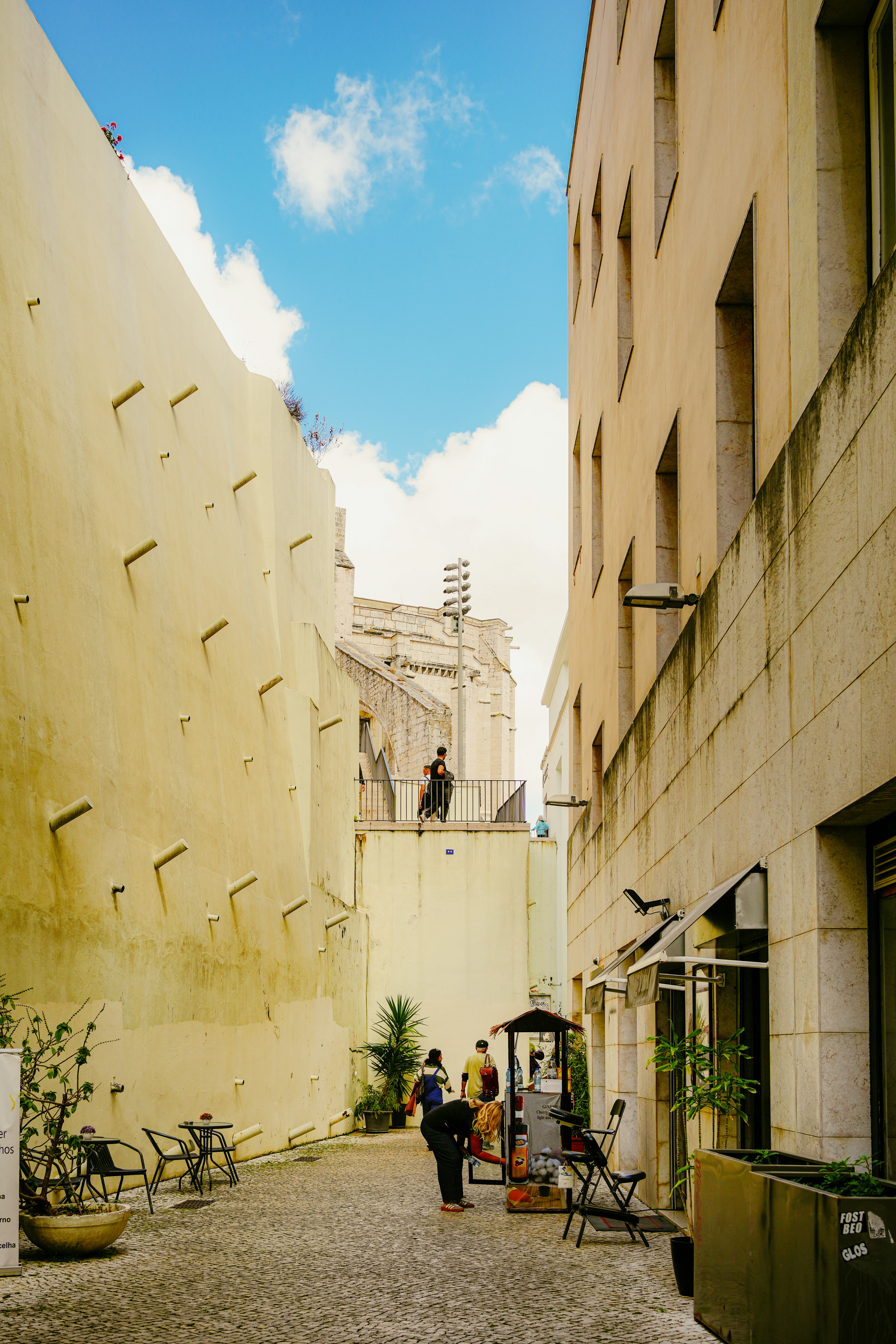Courtyard Crossing: A Narrow Street Between Sunlit Facades