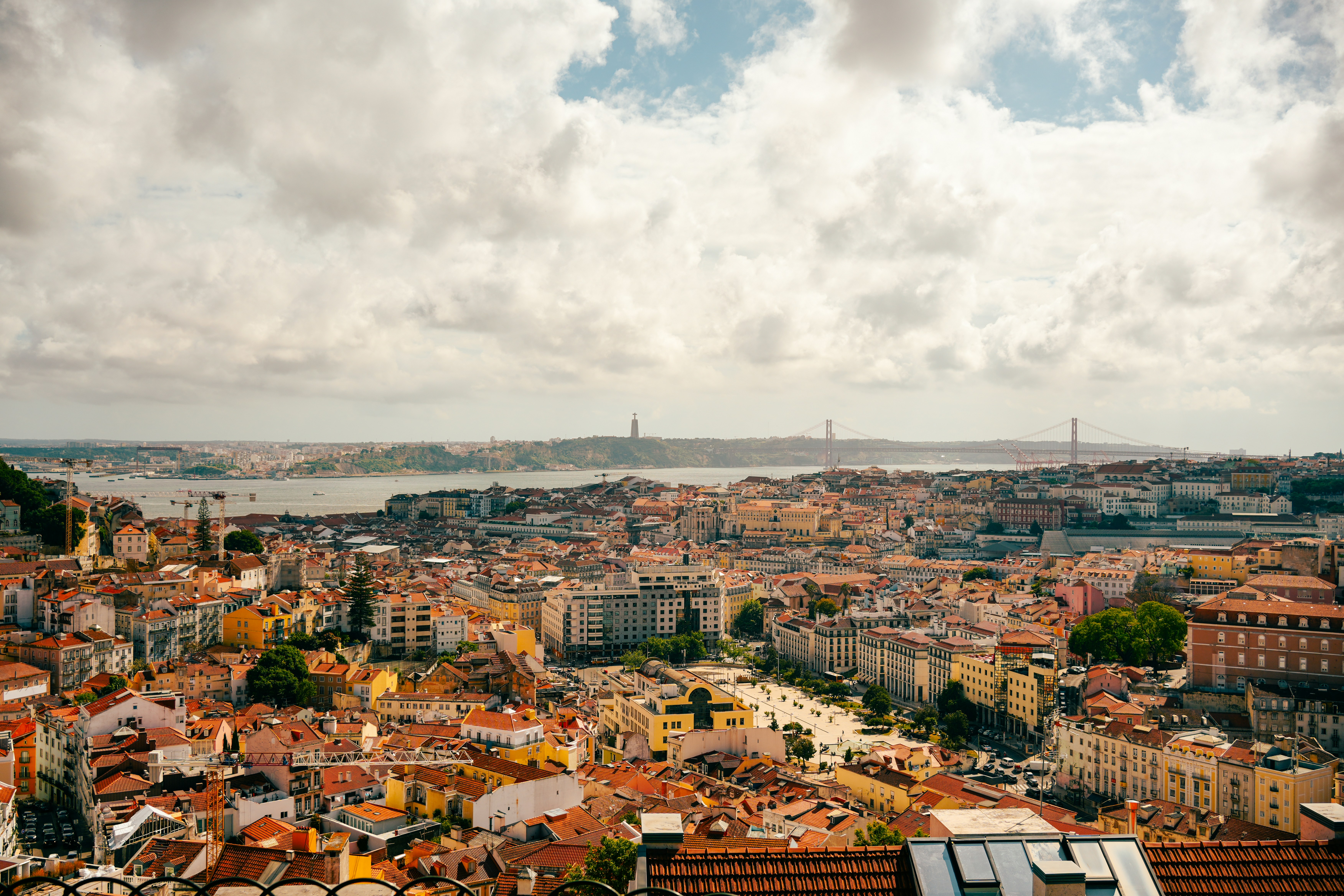 Rooftop Panorama Over a Sunlit European Harbor Town