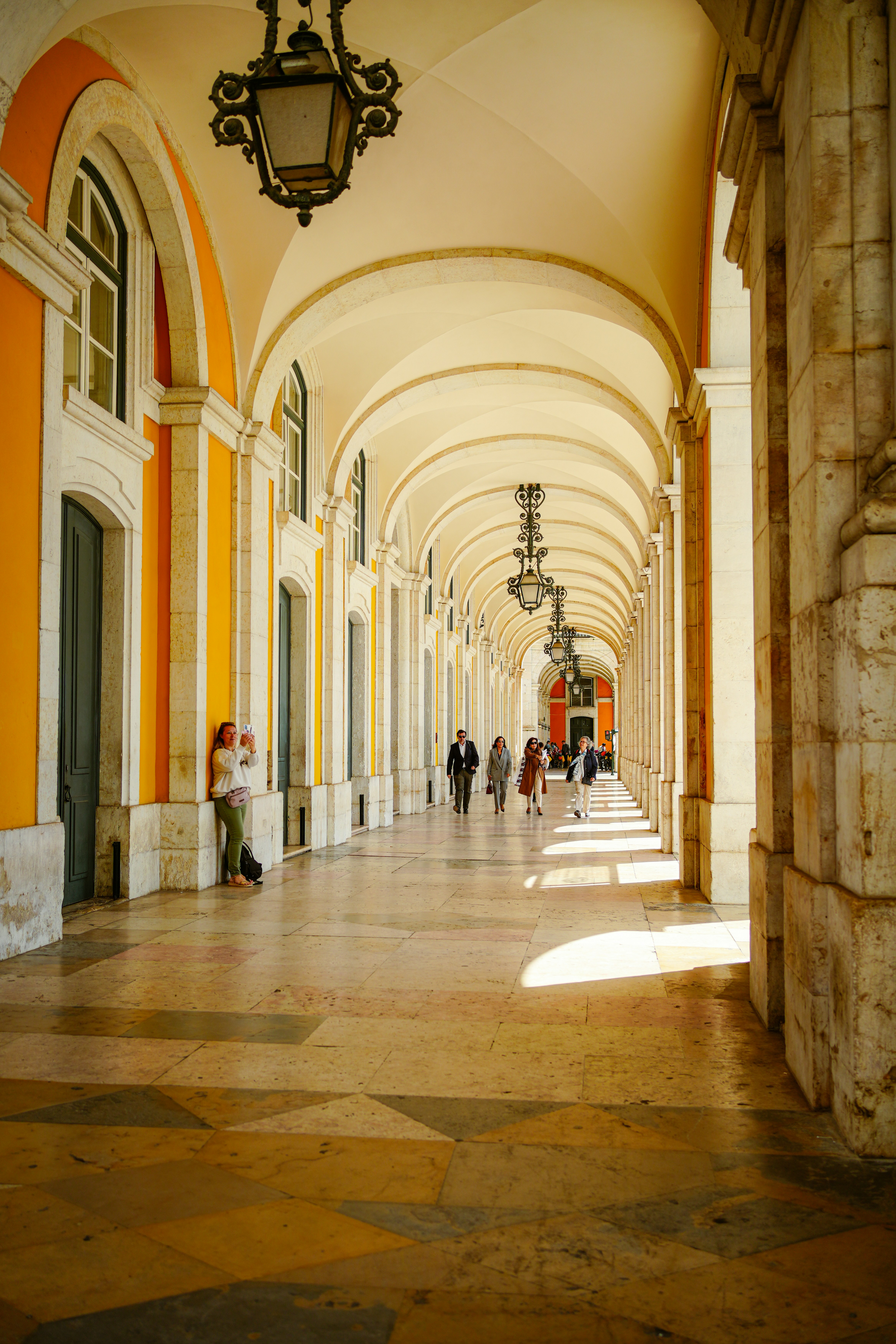 Arcaded Light: A Sunlit Hallway Stretches into Distance