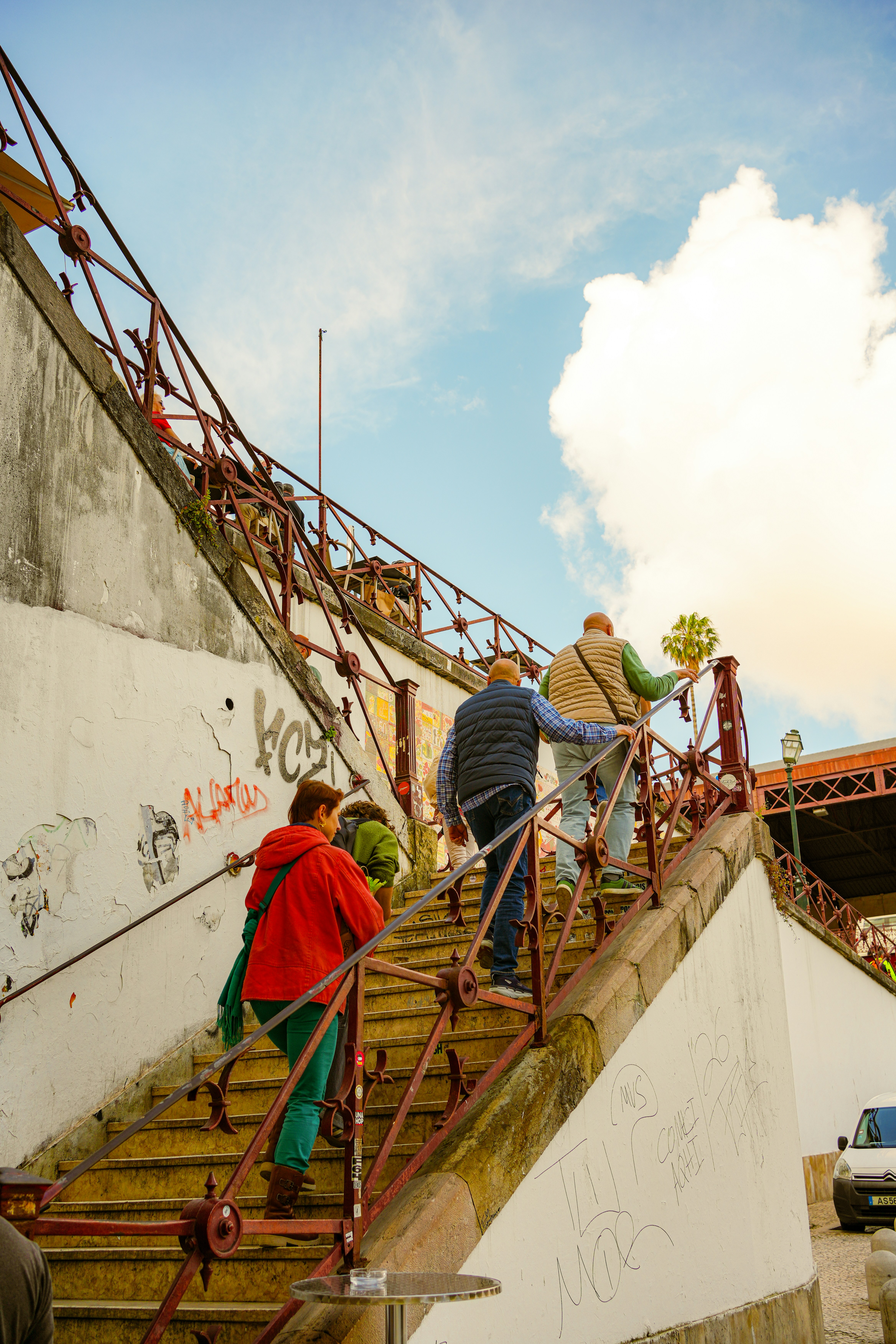 Ascending the Painted Railing: A Moment of Shared Ascent