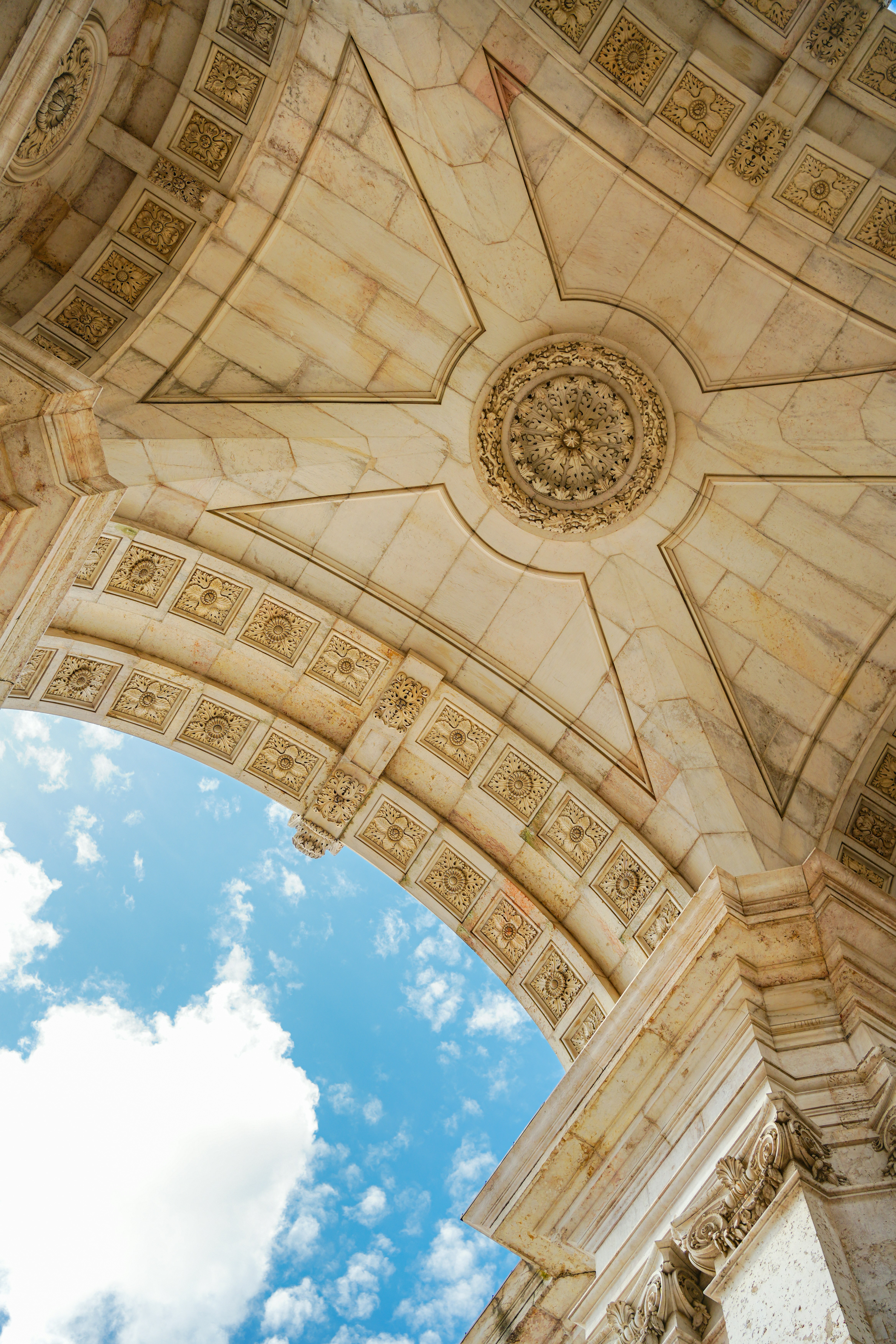 Stone Archways and Sky: A Sunlit Vault of Ornament