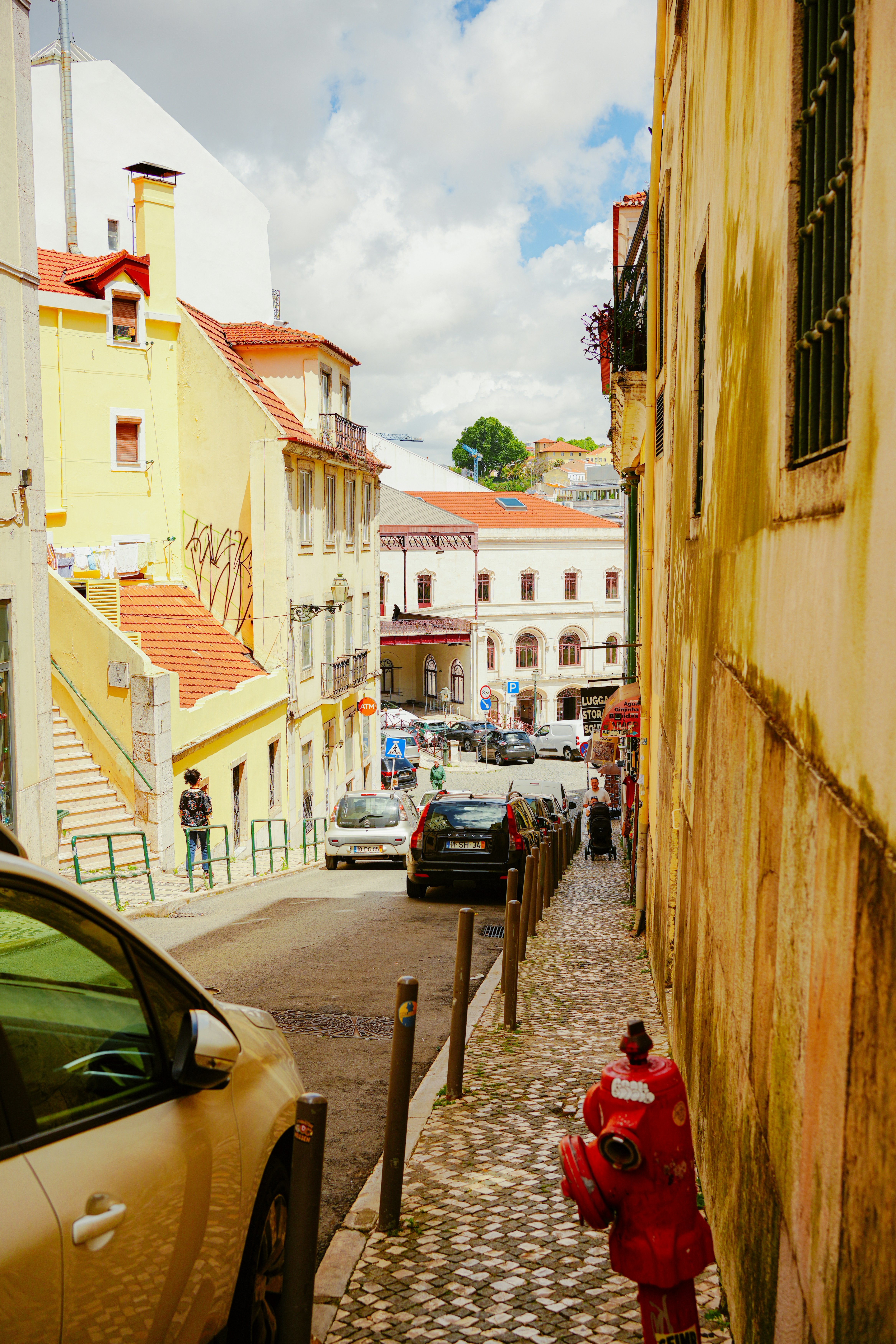 Sunlit Calle of Lisbon-like Hue: A Narrow Cobblestone Lane