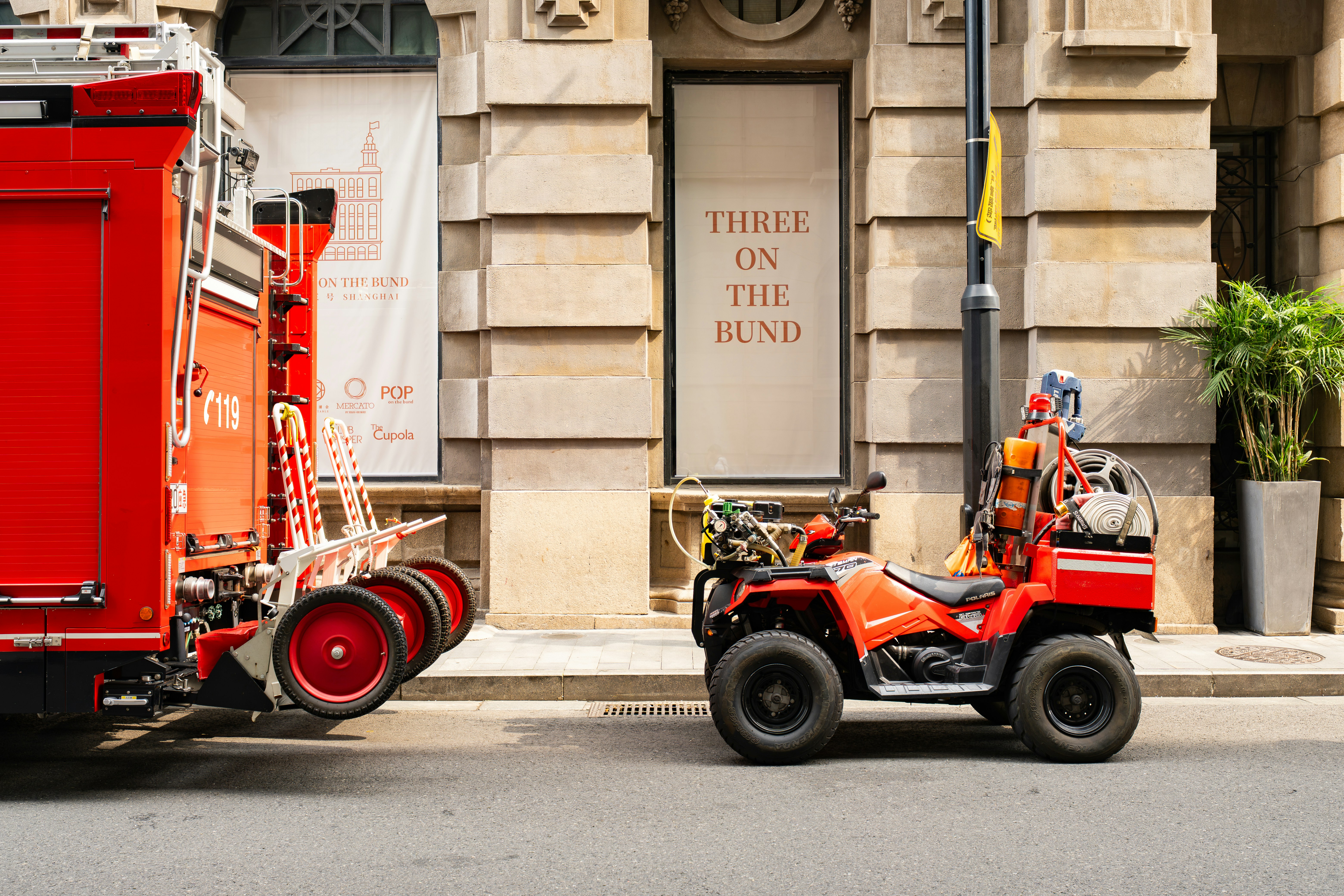 Red Response: Fire Apparatus Resting Before a City Facade
