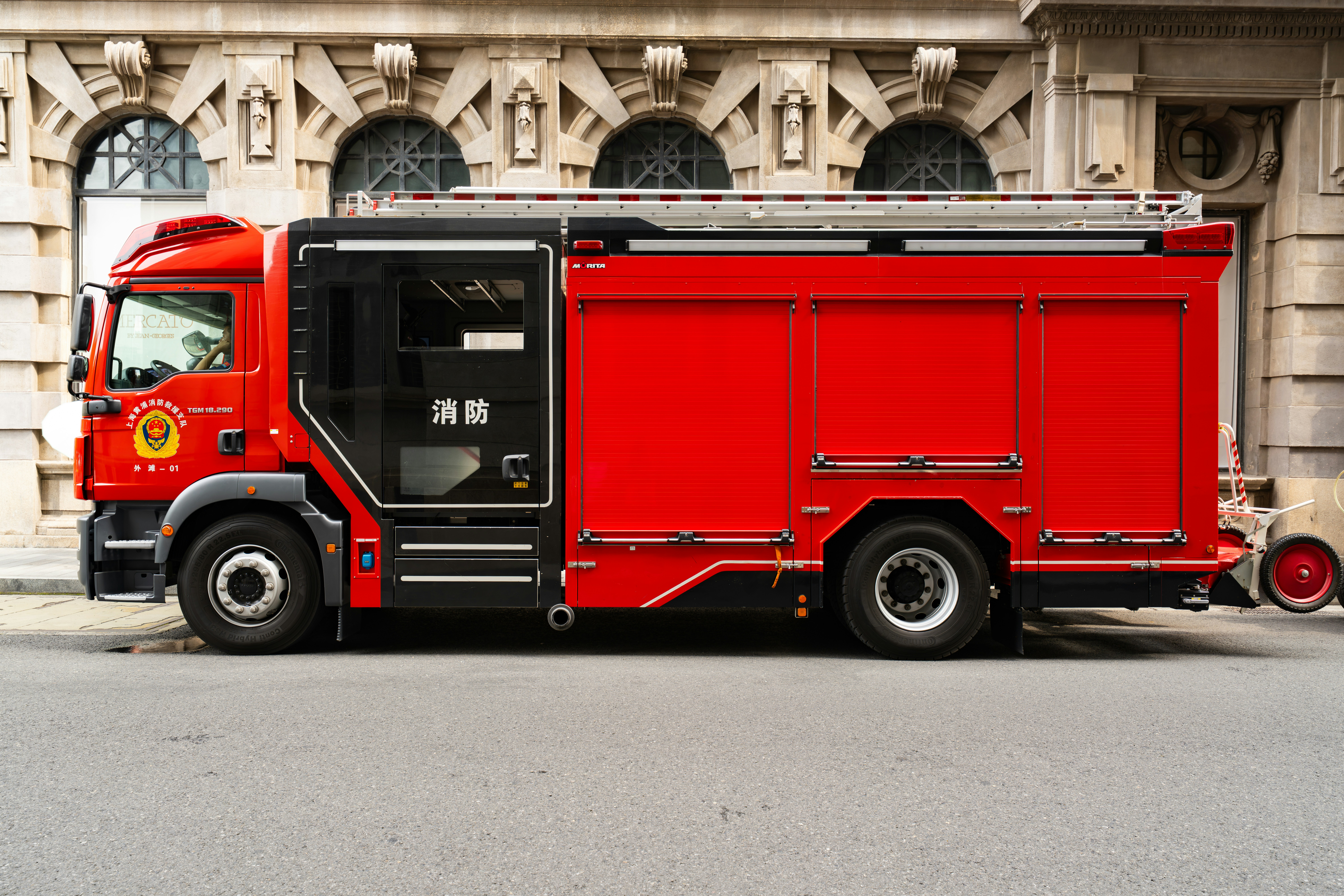 Red Sentinel on the City Street: A Fire Engine in Profile