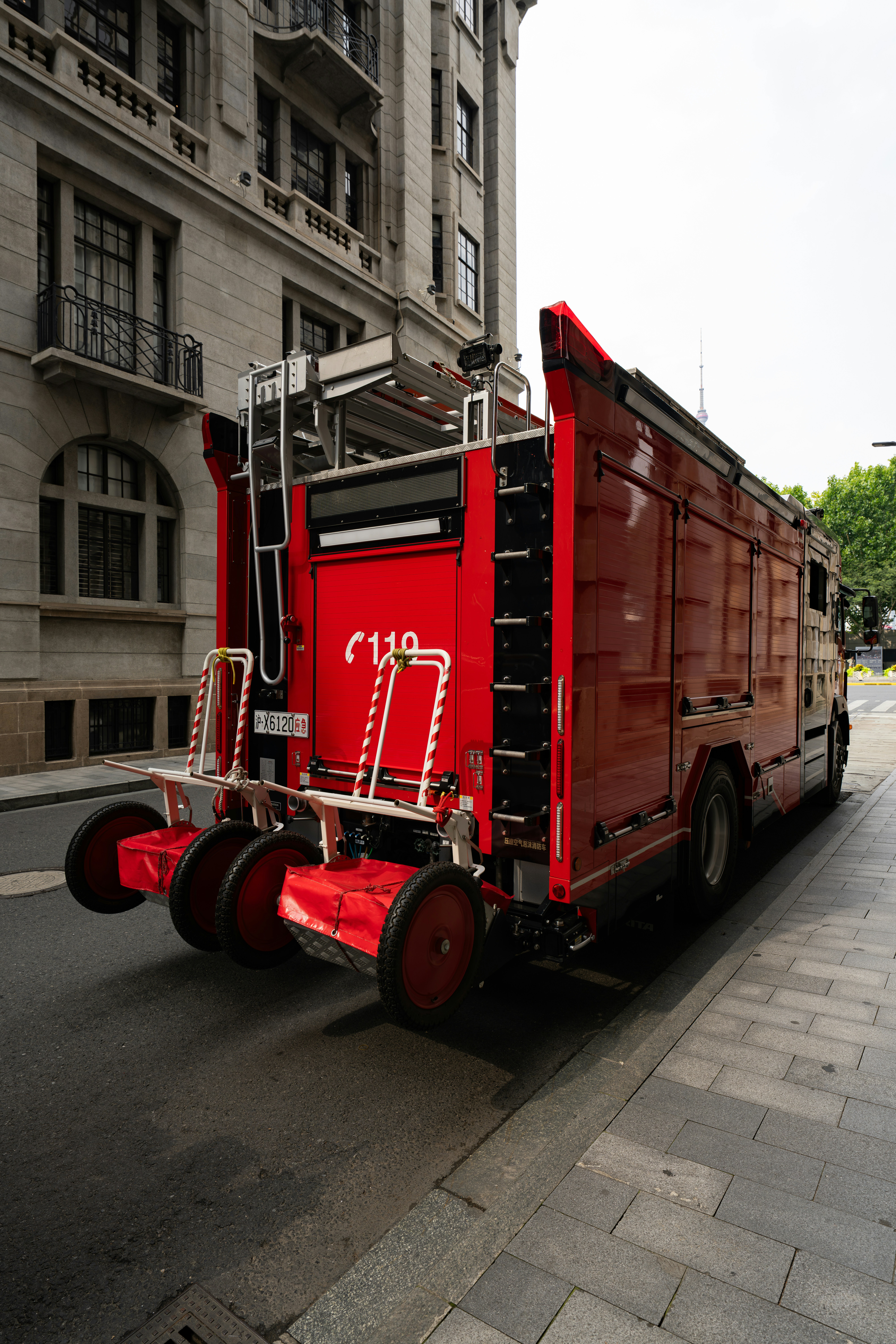 Red Fire Engine Resting Along a City Street
