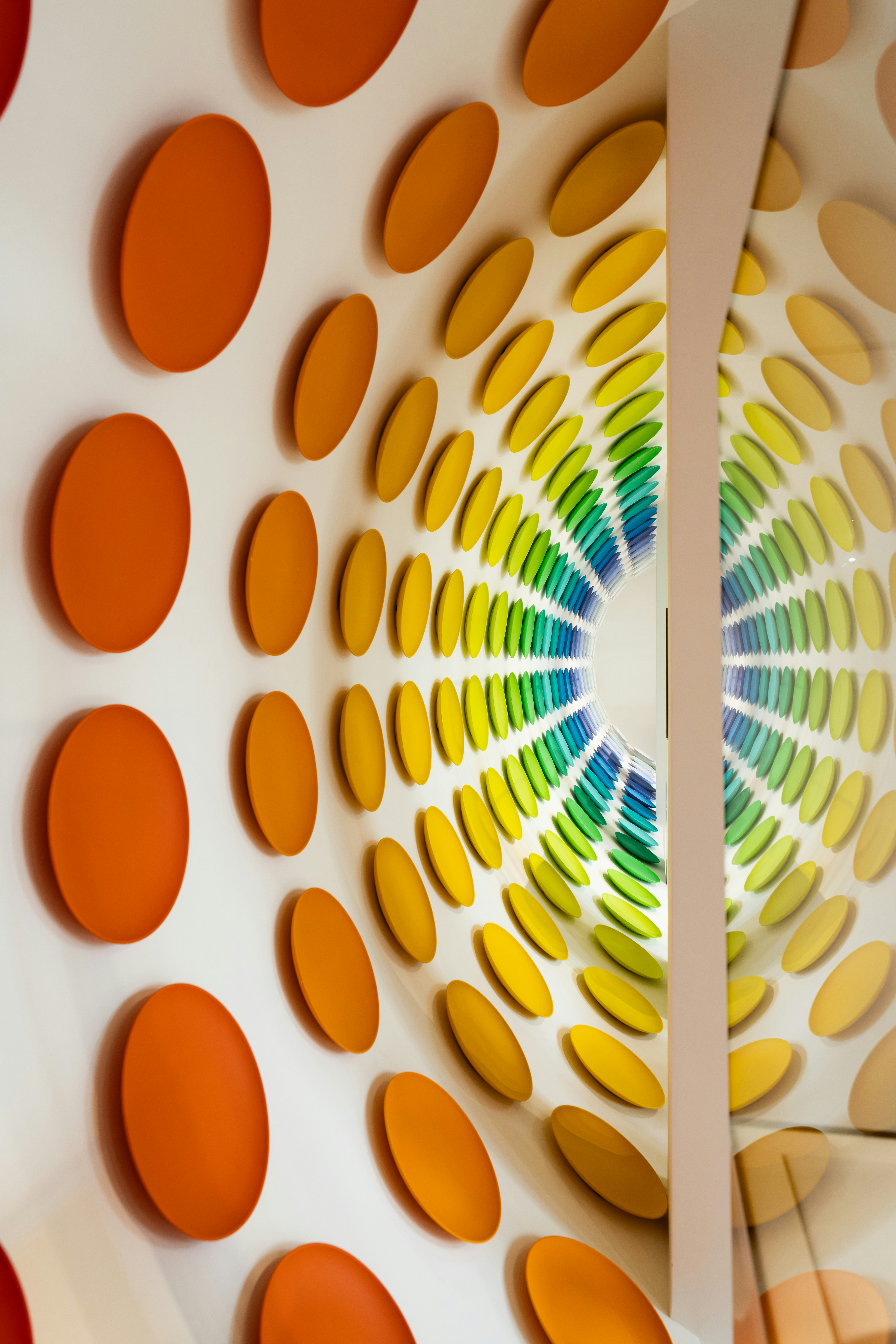 Circular Rainbow Corridor: A Spiral of Colored Orbs Receding into Light
