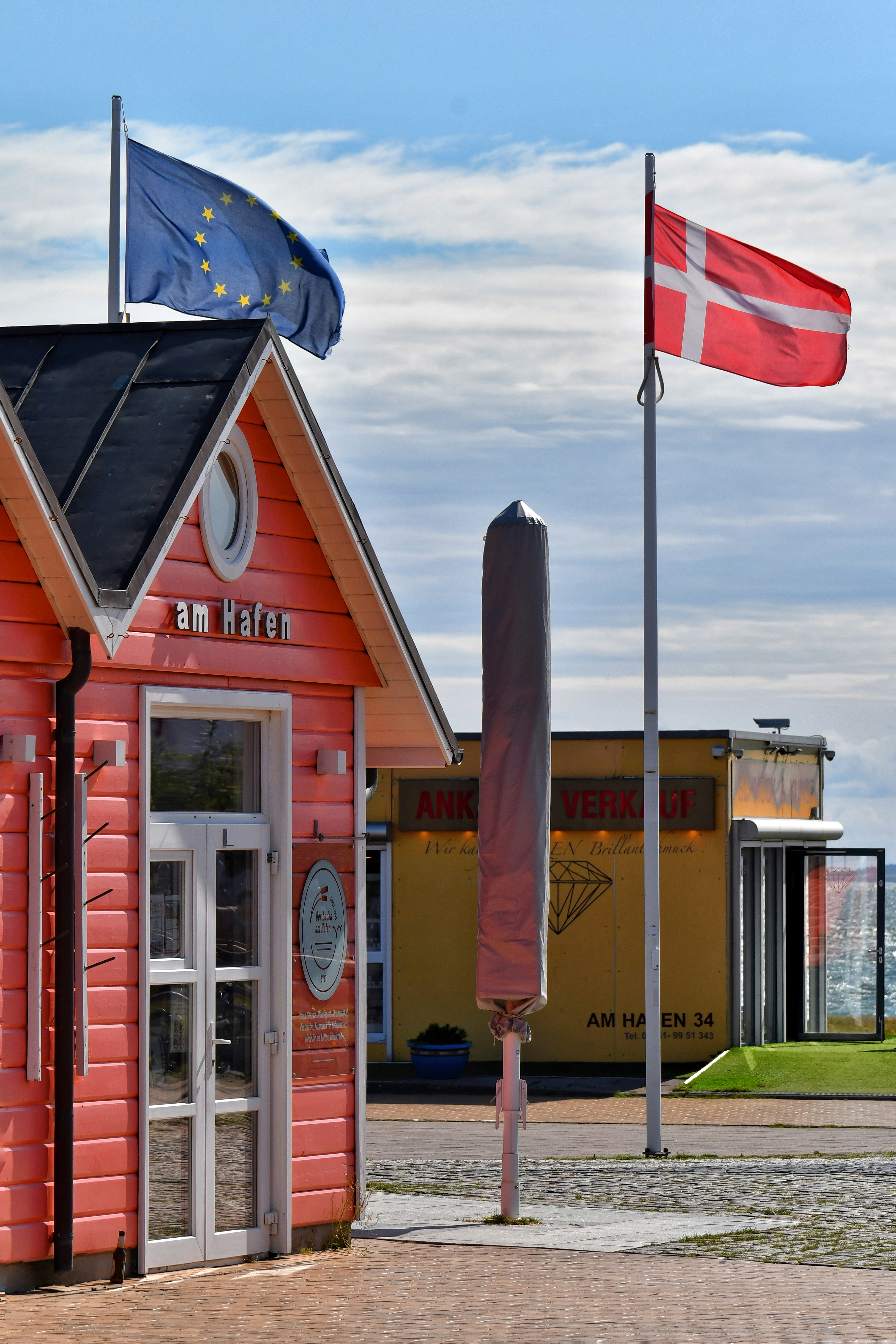 Two Flags over a Colorful Coastal Snack Stop
