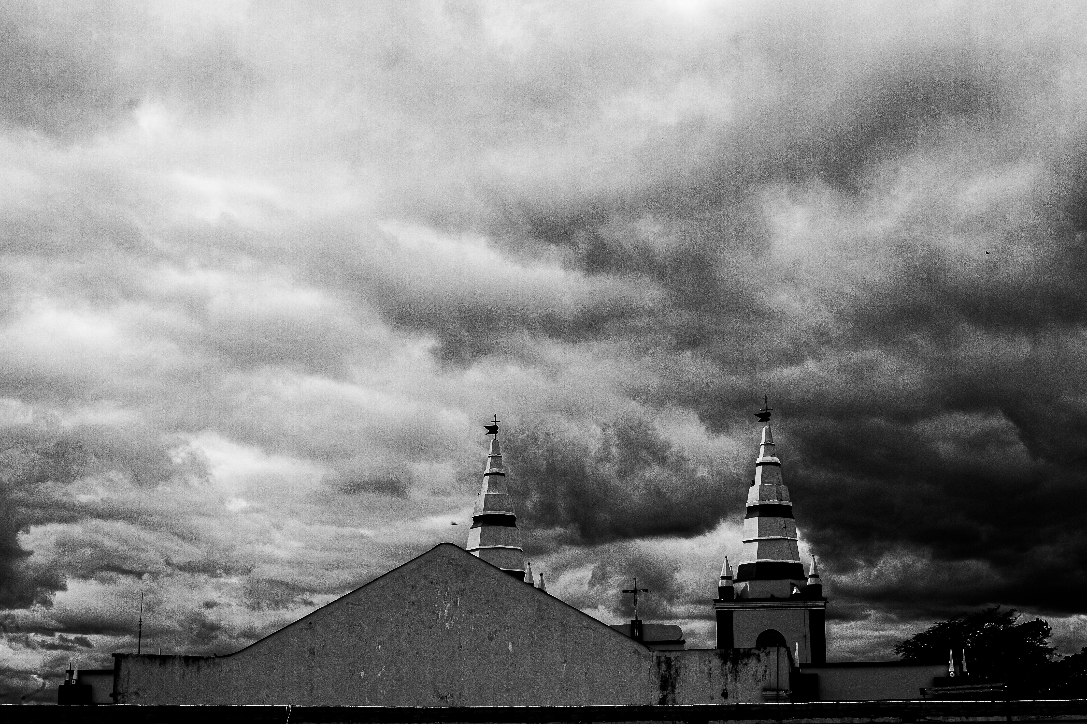 Storm-Lashed Rooftops Under a Churning Sky