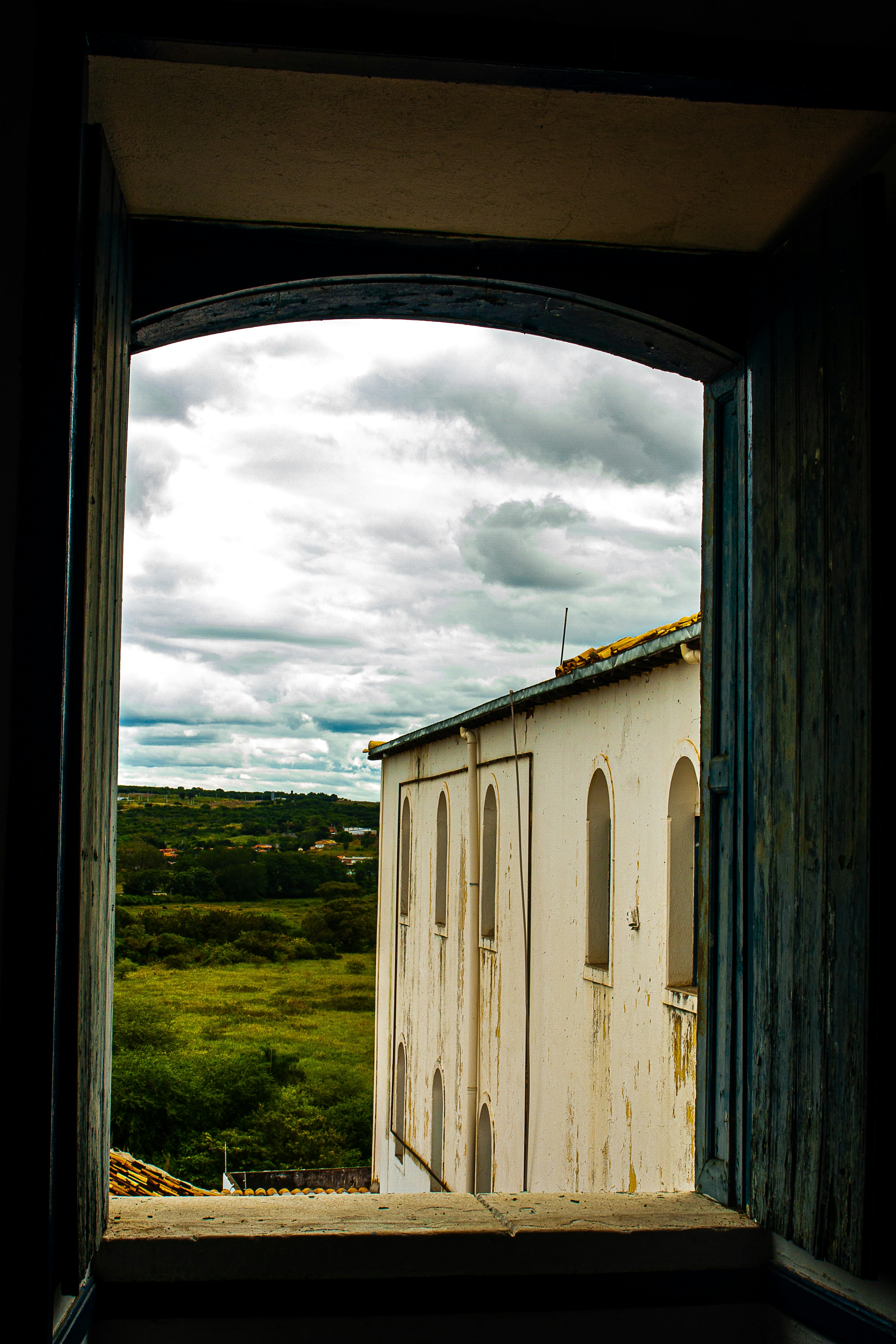 Through the Window to Quiet Hills Beyond